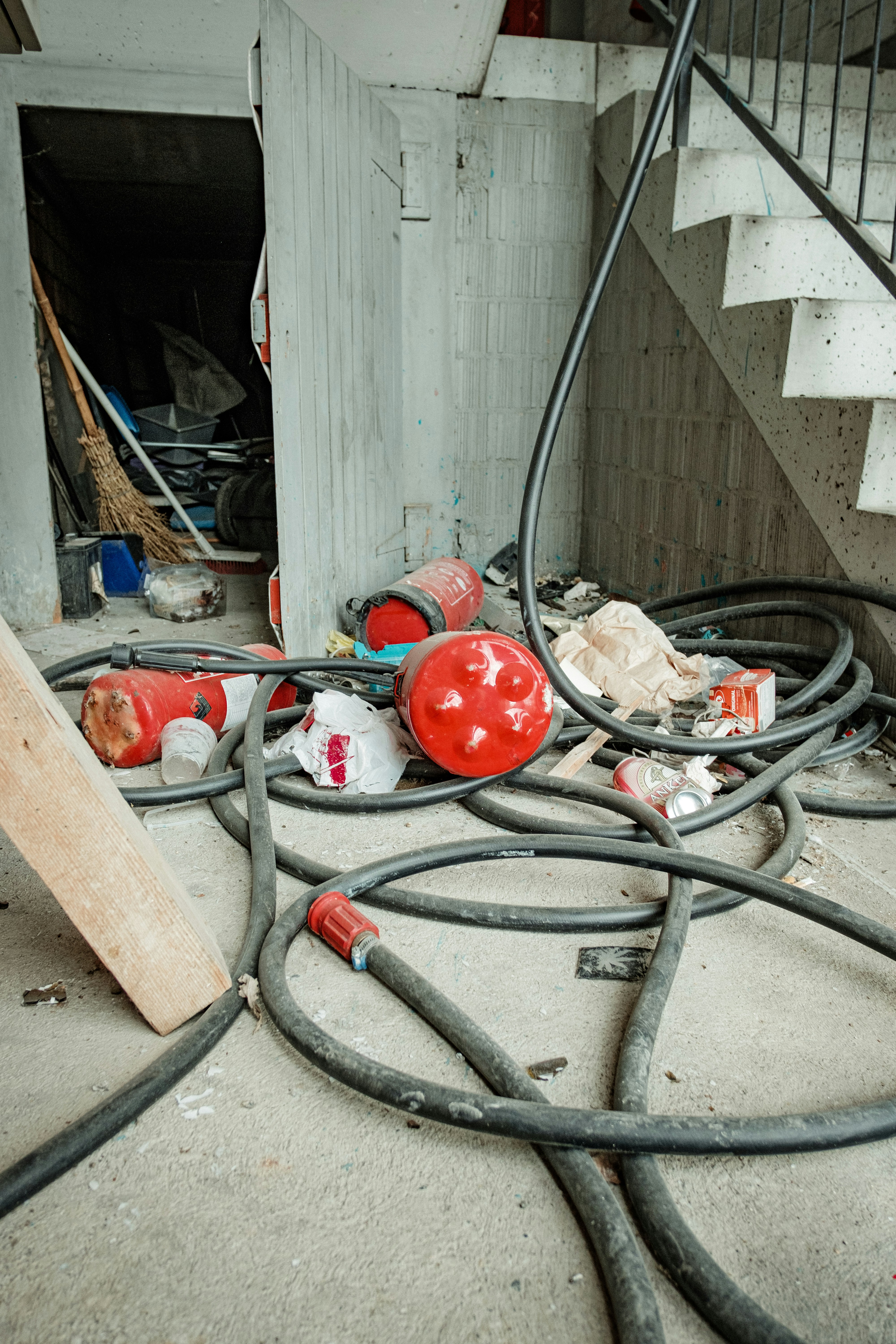 a bunch of wires and a bat laying on the ground