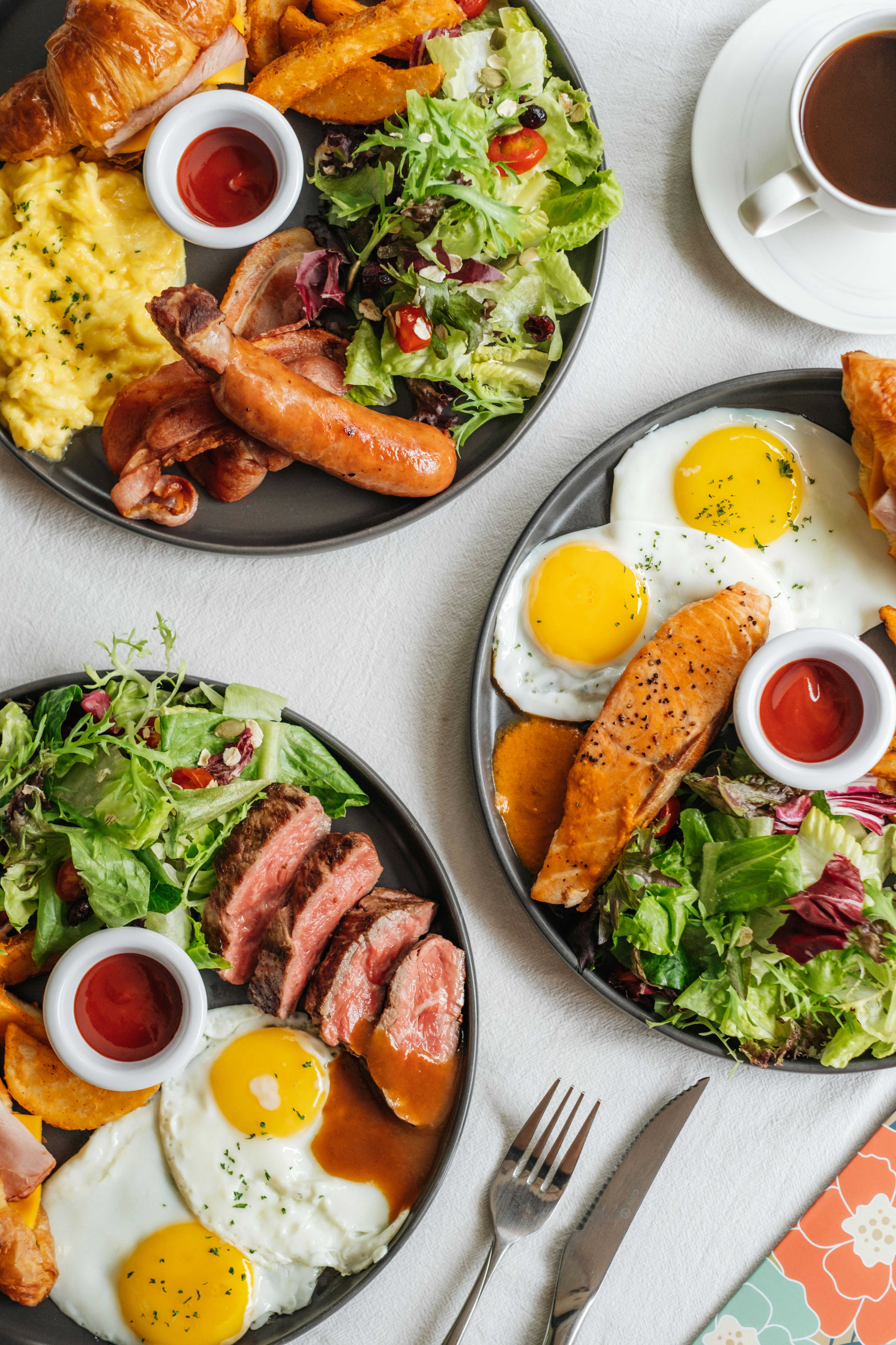 Three plates of breakfast food on a table photo – Free Food Image on ...