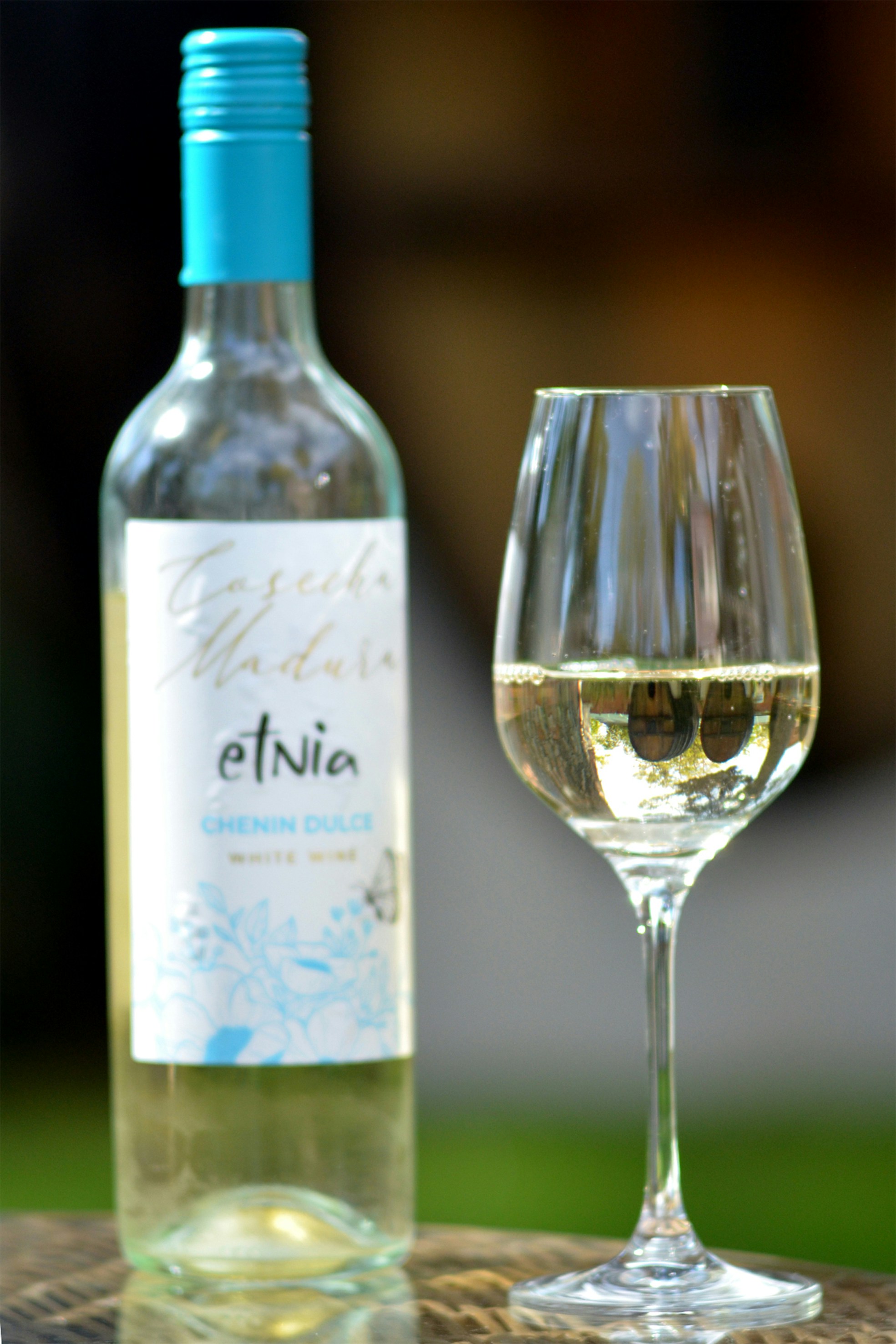 a bottle of wine and a glass on a table