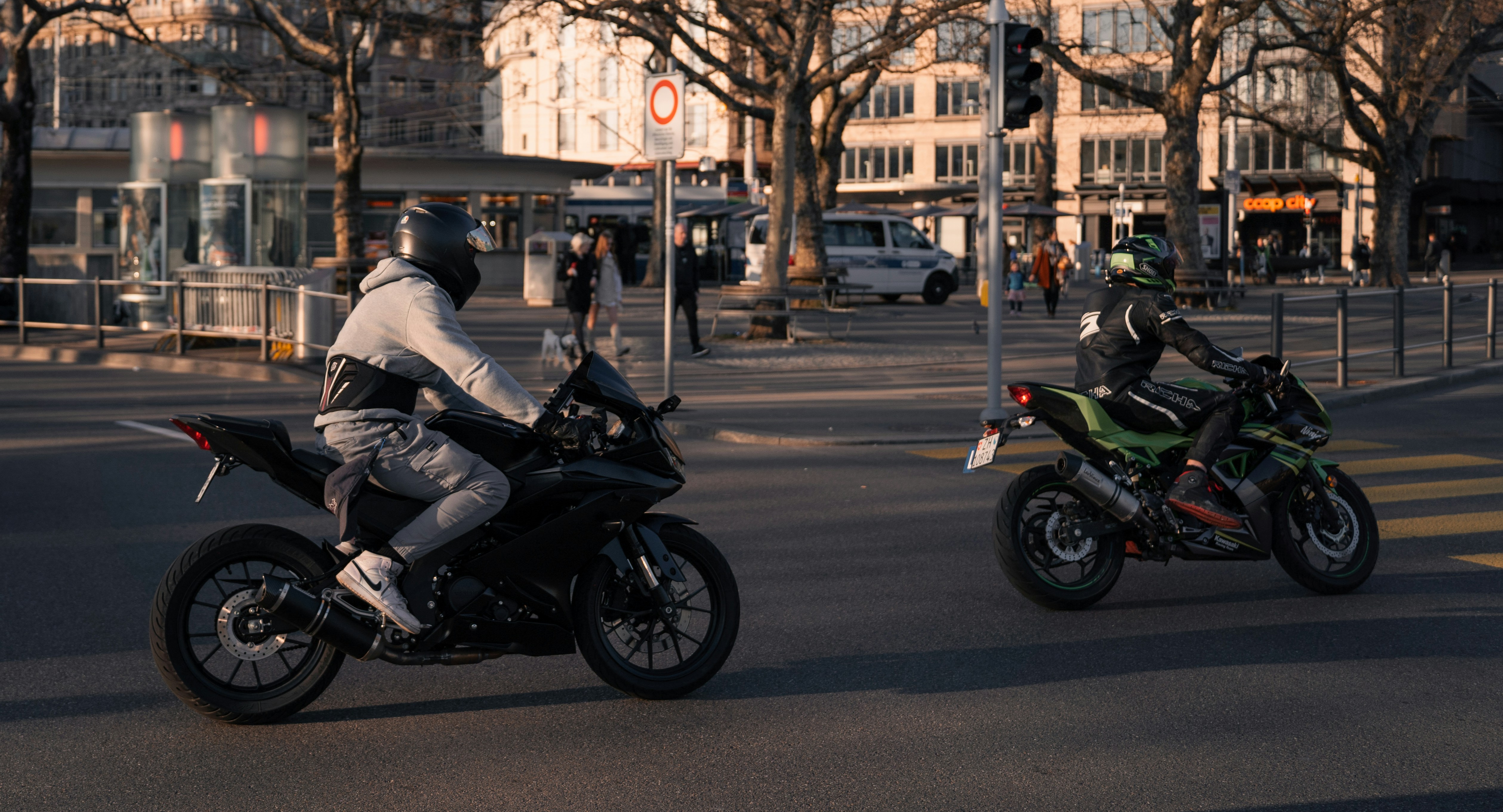 Two people riding motorcycles on a city street photo – Free Car Image ...