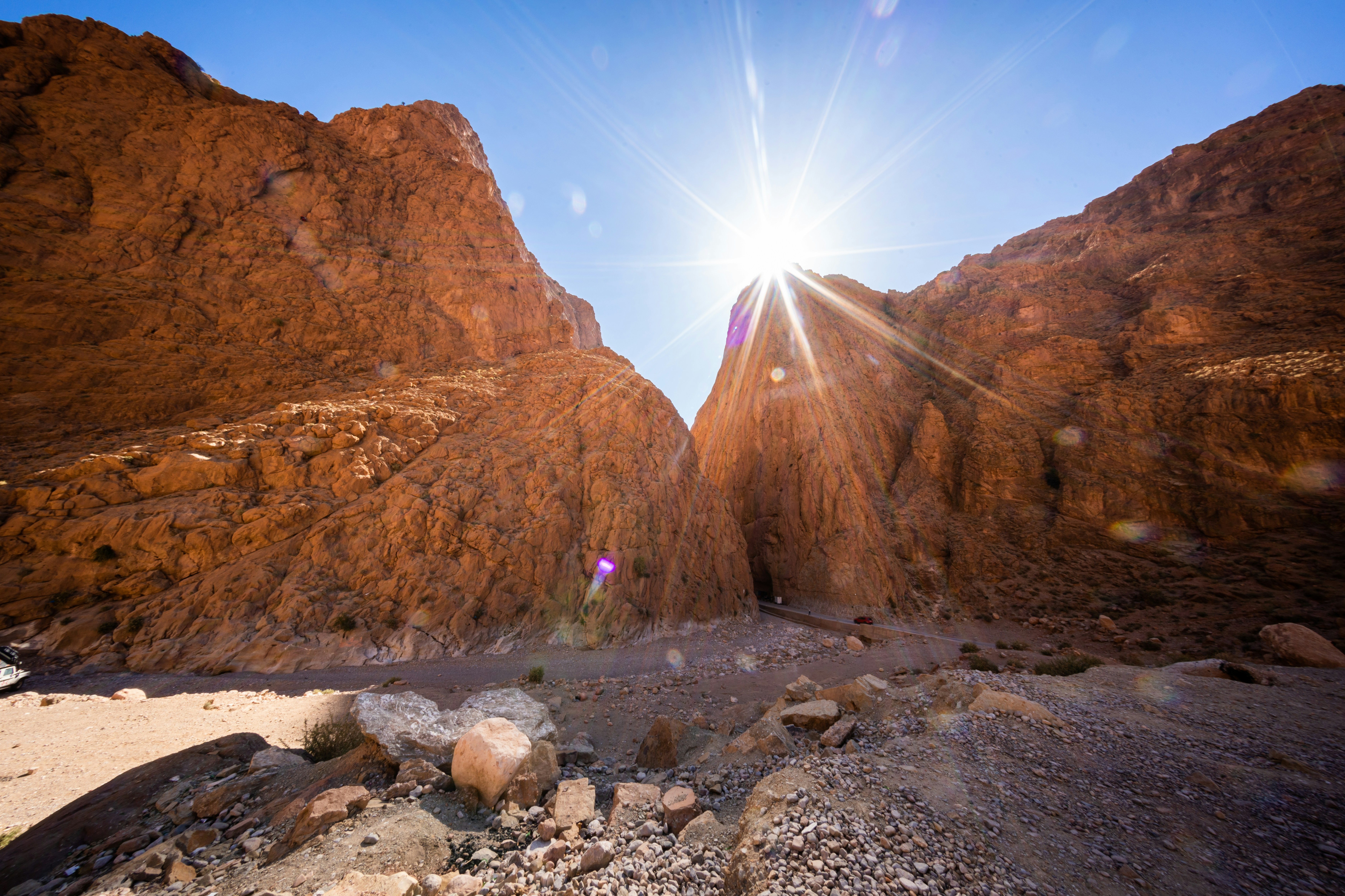 Sunburst Between Red Canyon Walls: Dawn Over the Rugged Gorge