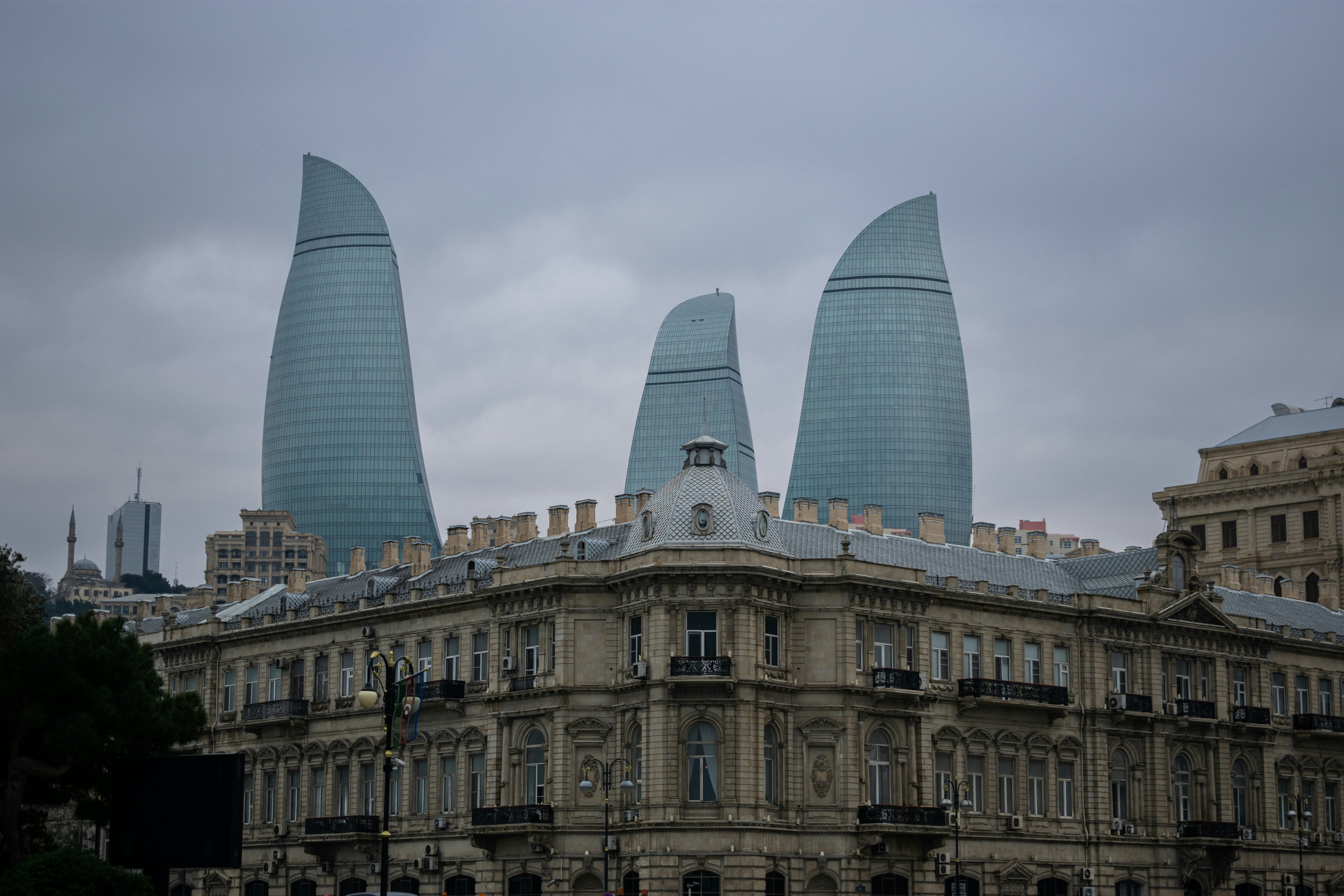 A very tall building with some very big towers photo – Free Baku Image ...