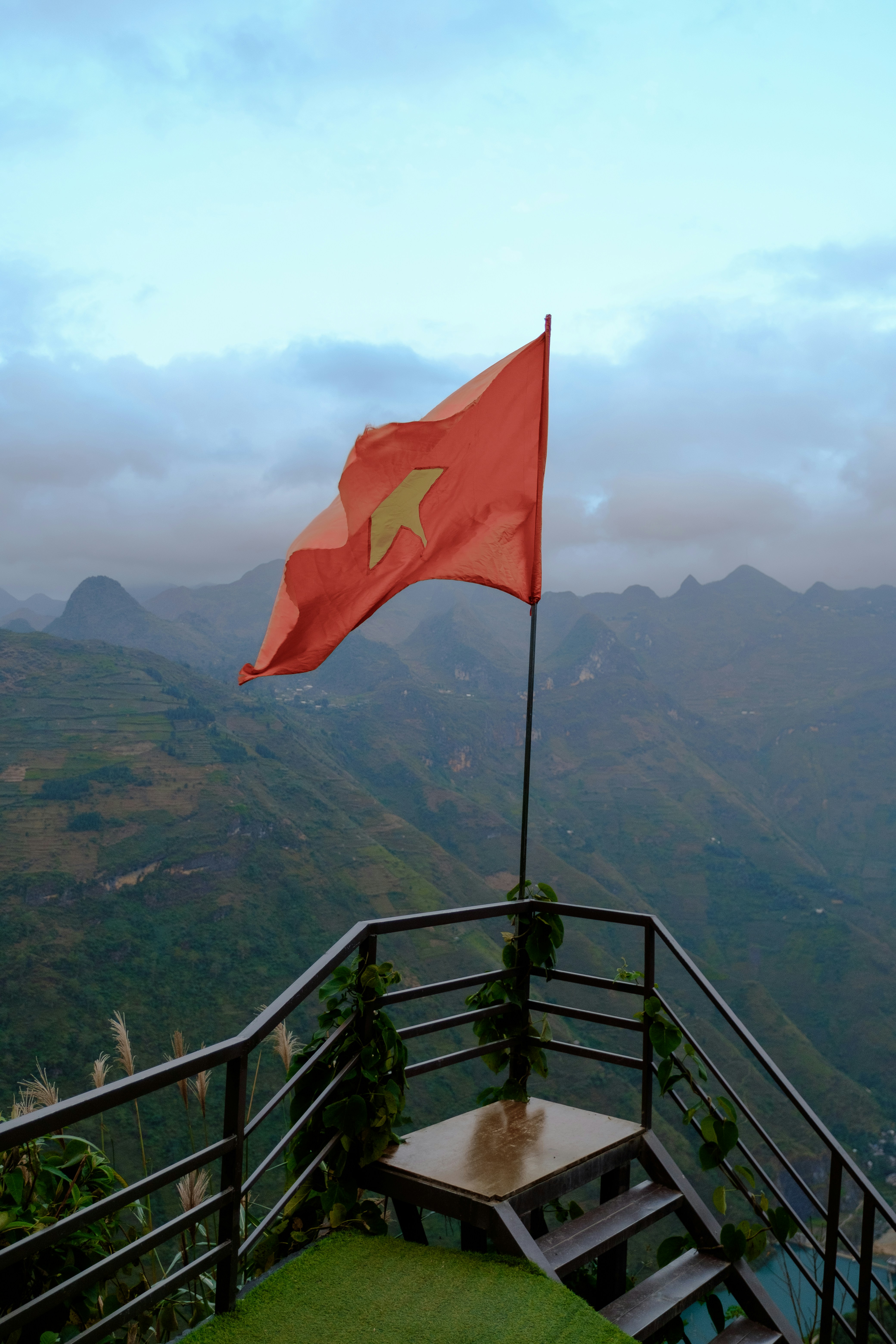 A flag flying on top of a metal railing photo – Free Vietnam Image on ...