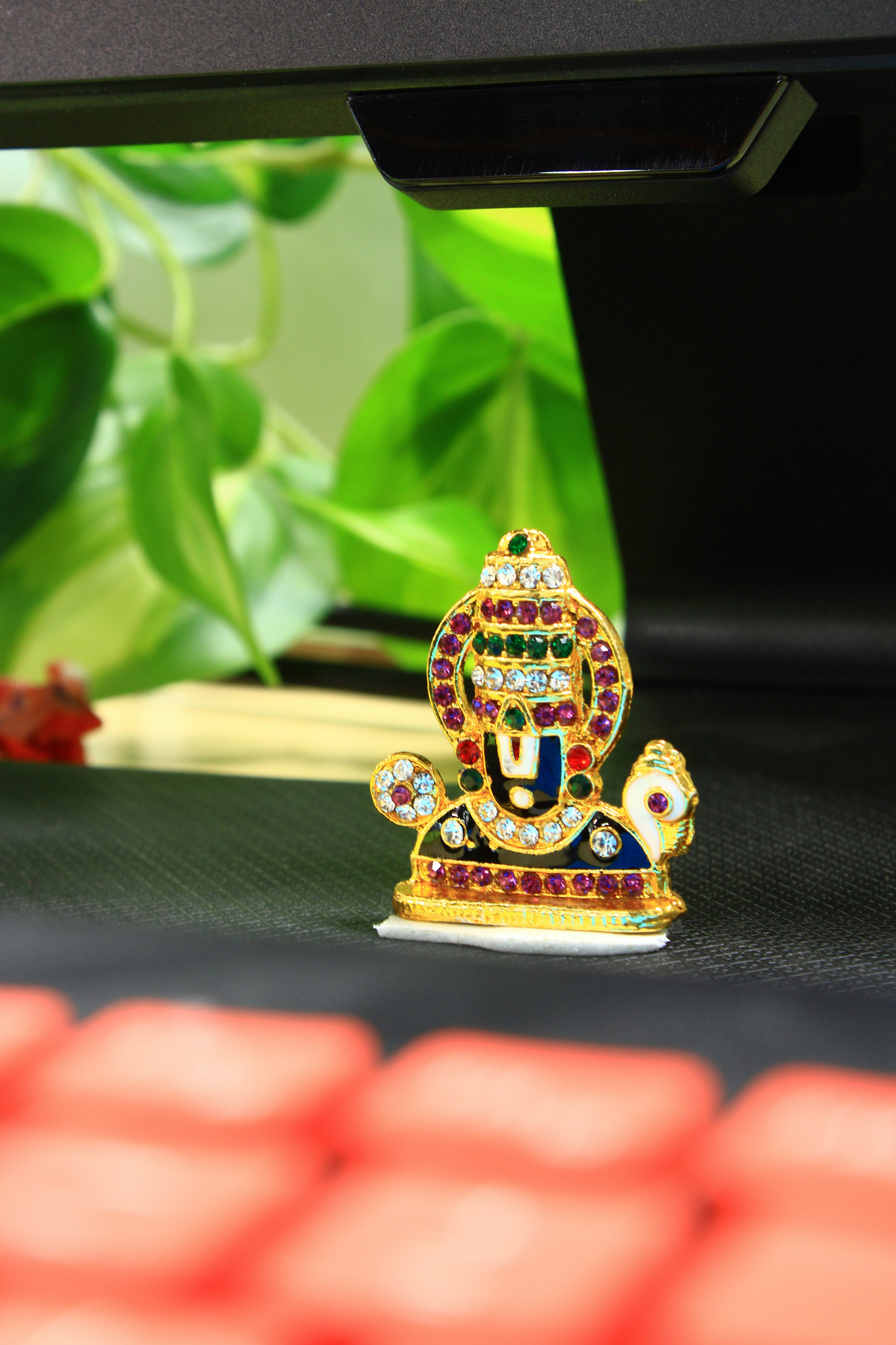 A small statue of a god on a table photo – Free Swipe park view Image ...