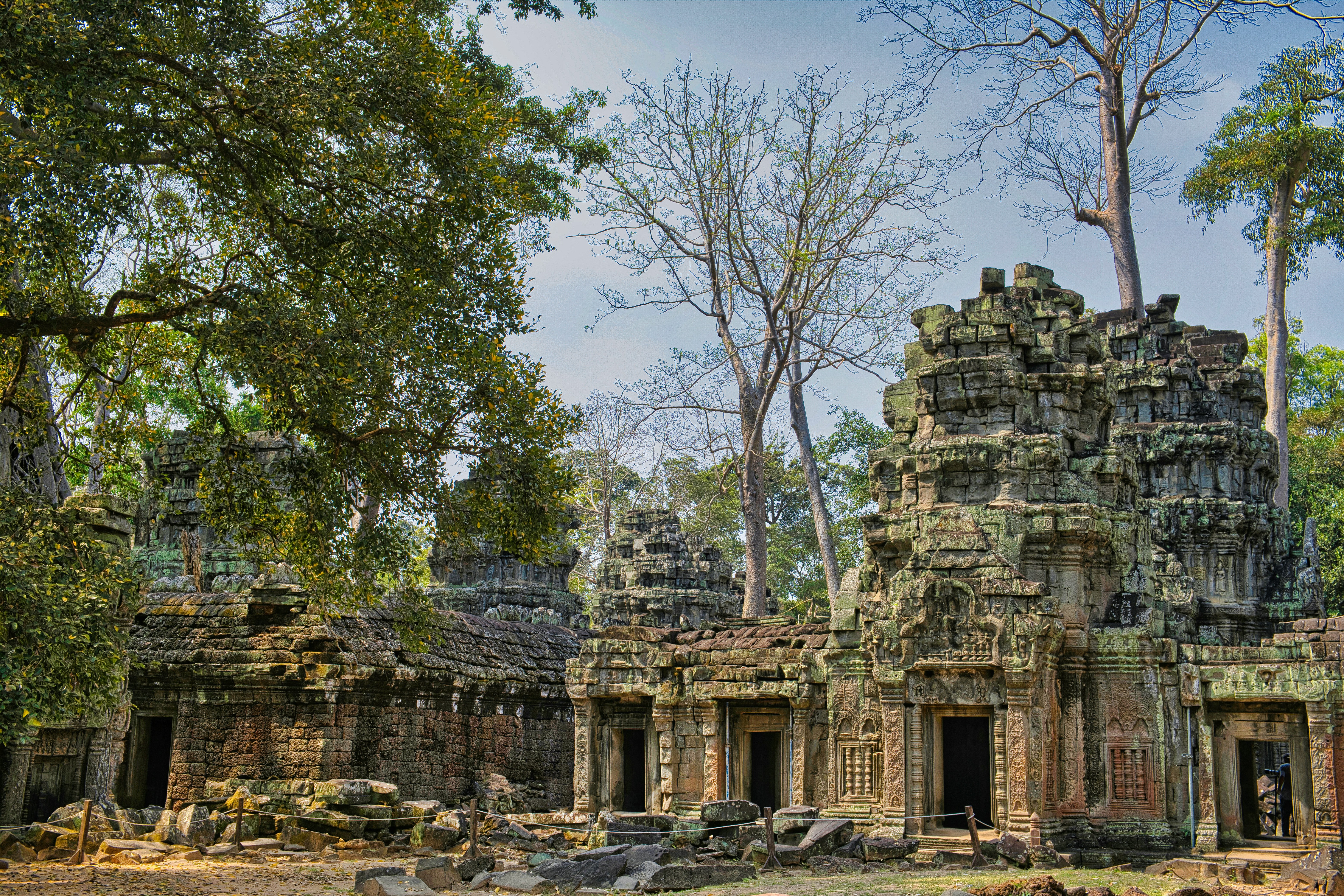 A group of stone buildings surrounded by trees photo – Free Bayon ...