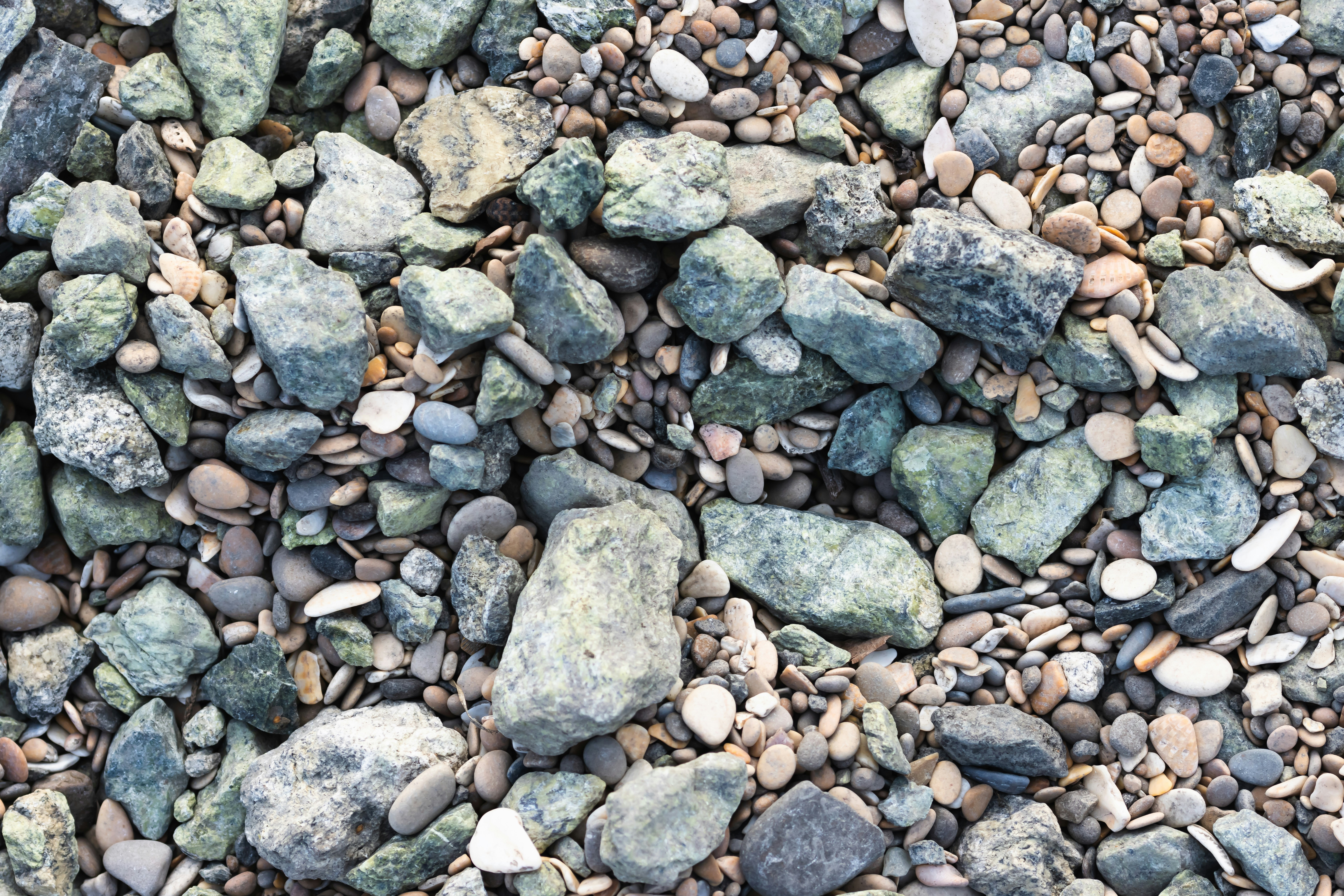 A bunch of rocks that are laying on the ground photo – Free Texture ...
