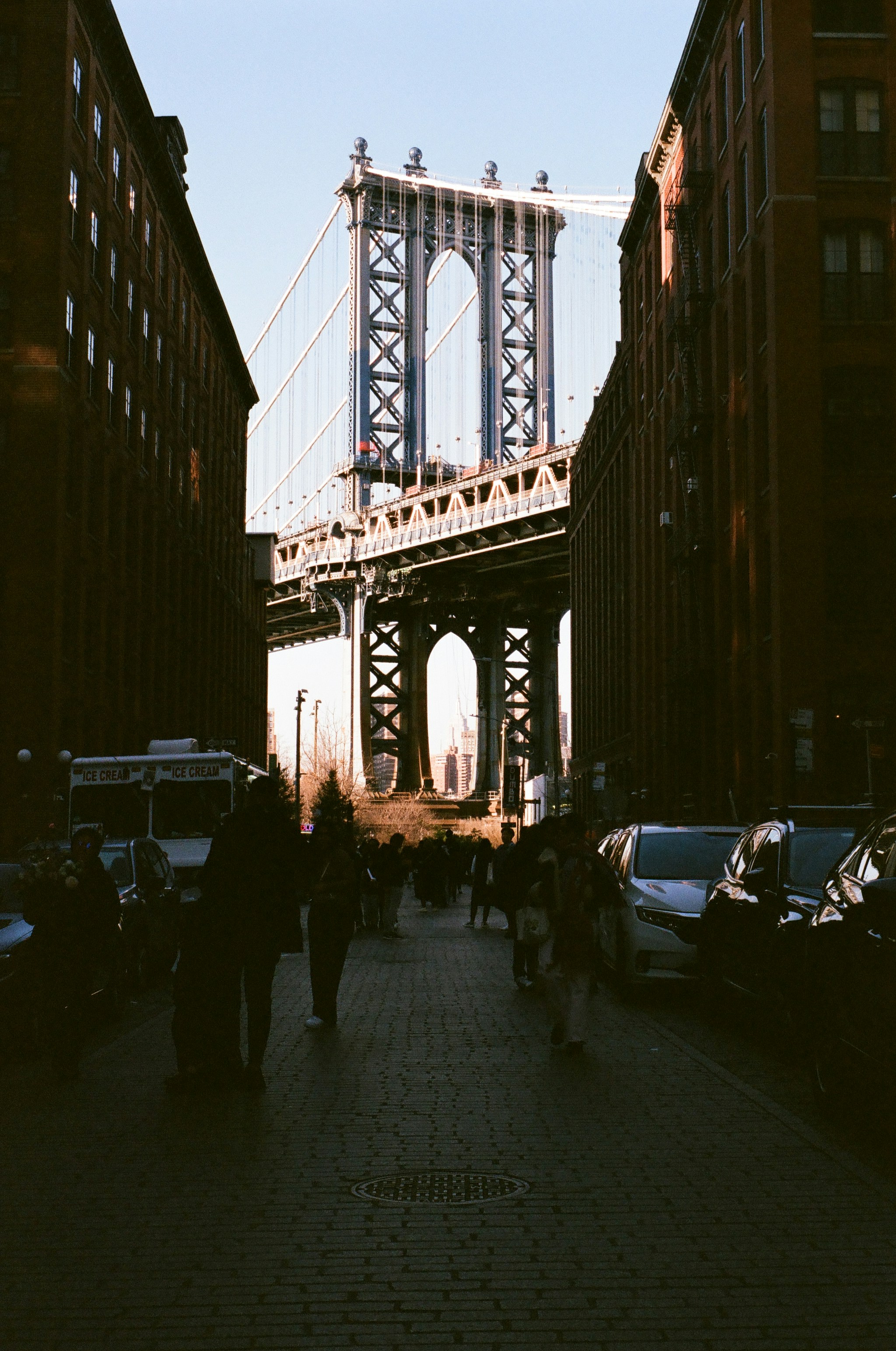 A group of people walking across a bridge photo – Free Bridge Image on ...