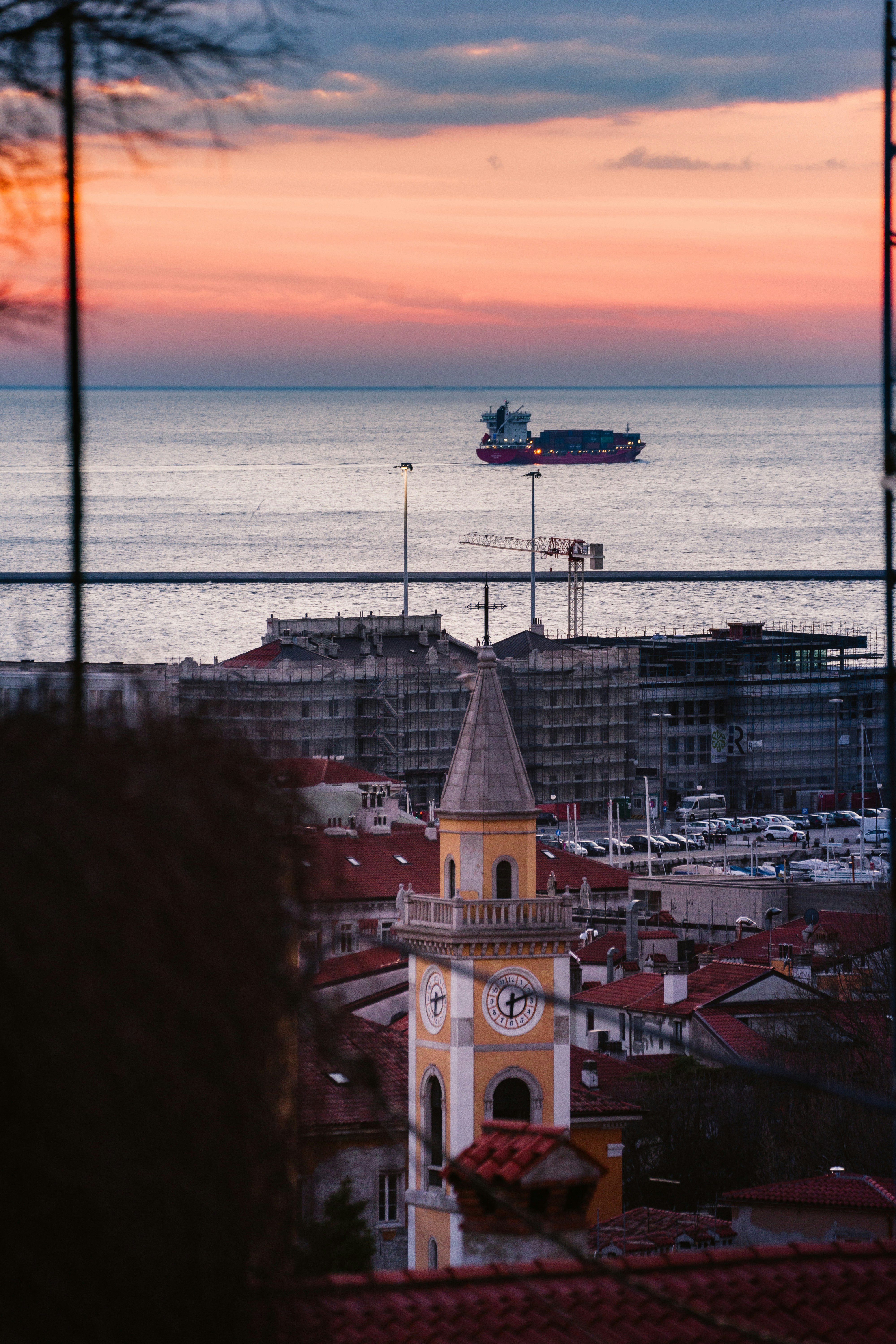 Sunset Over the Harbor: A Clocktower's Gentle Glow