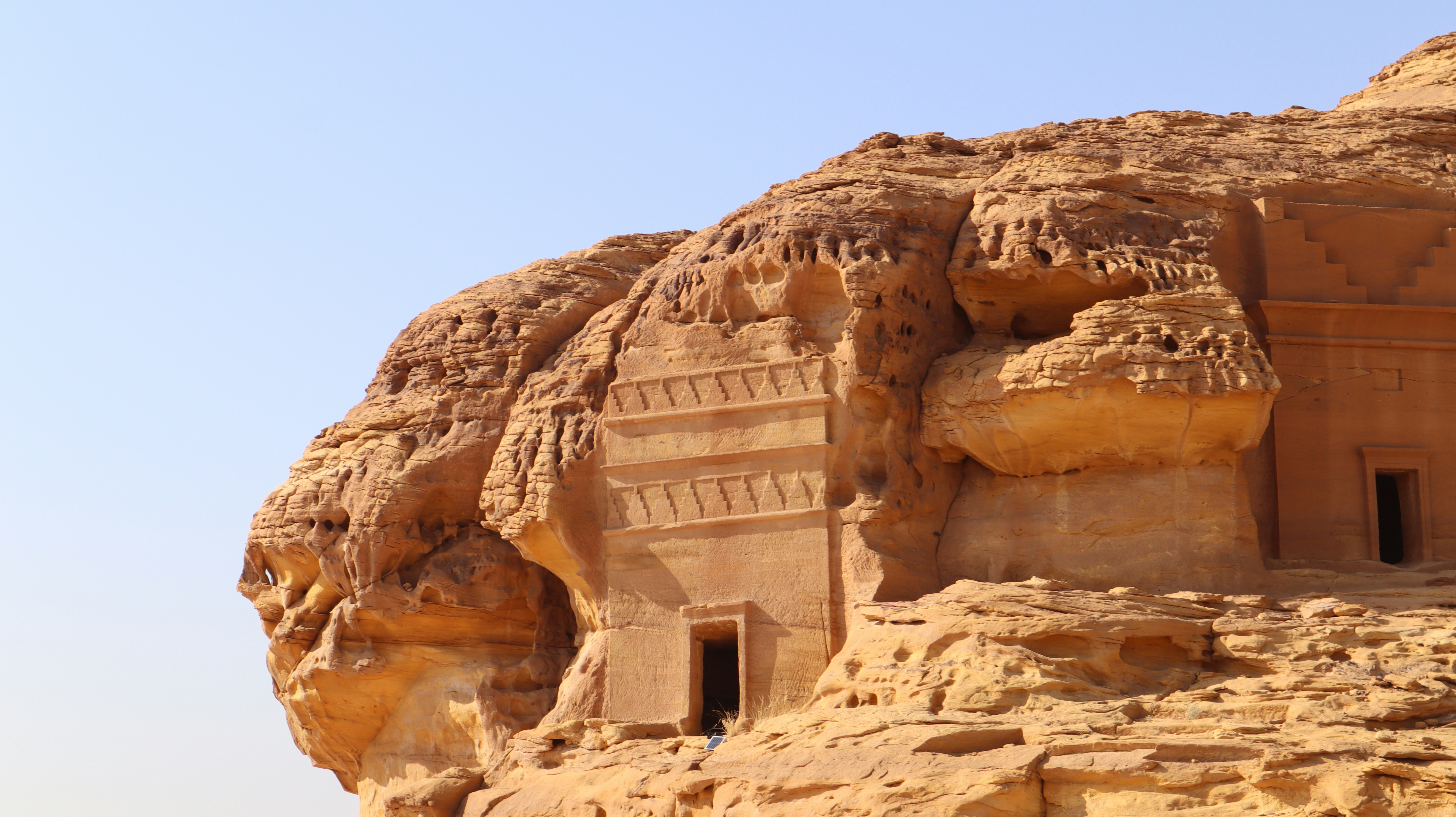 A building carved into the side of a mountain photo – Free Petra Image ...