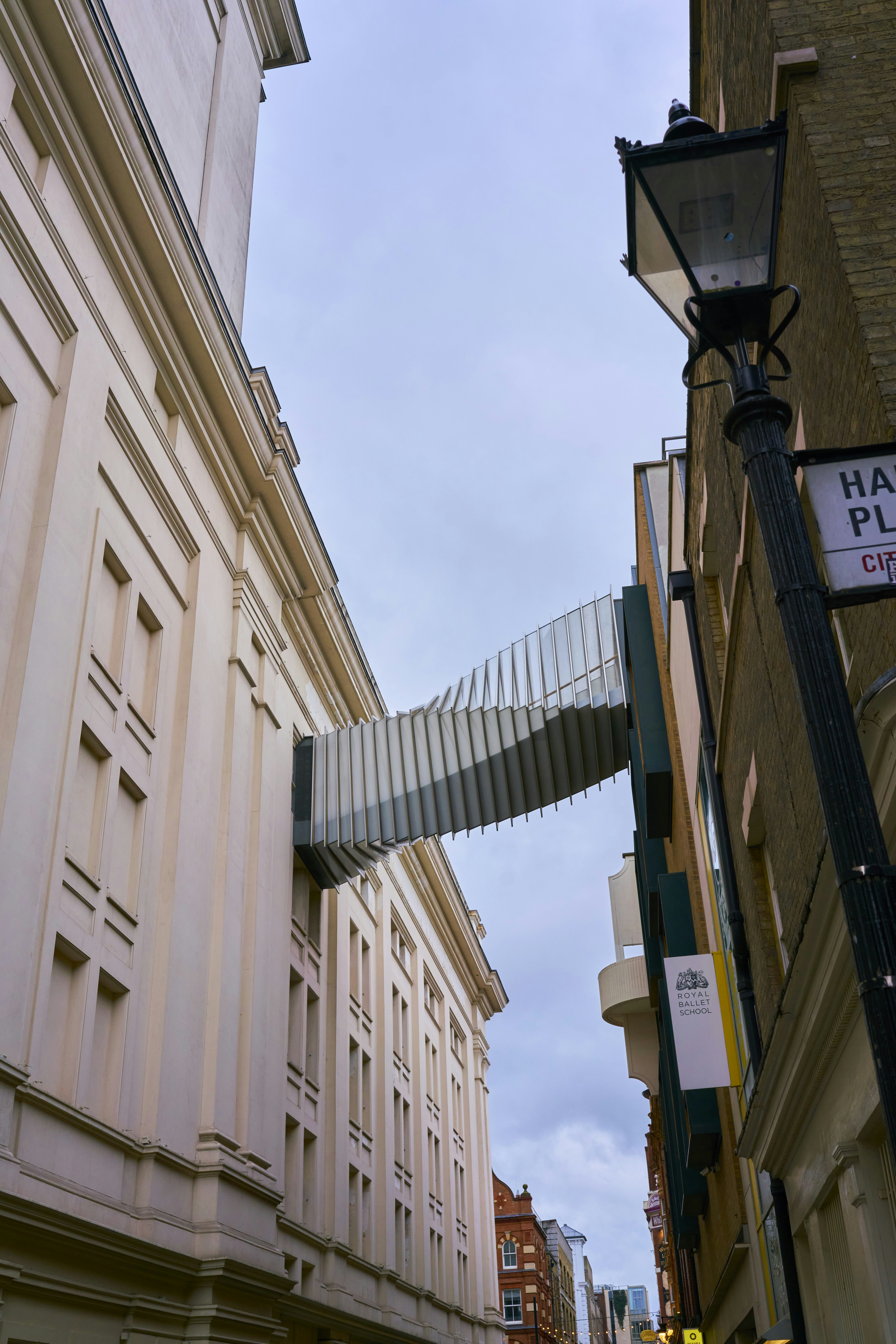 a street light hanging from the side of a building
