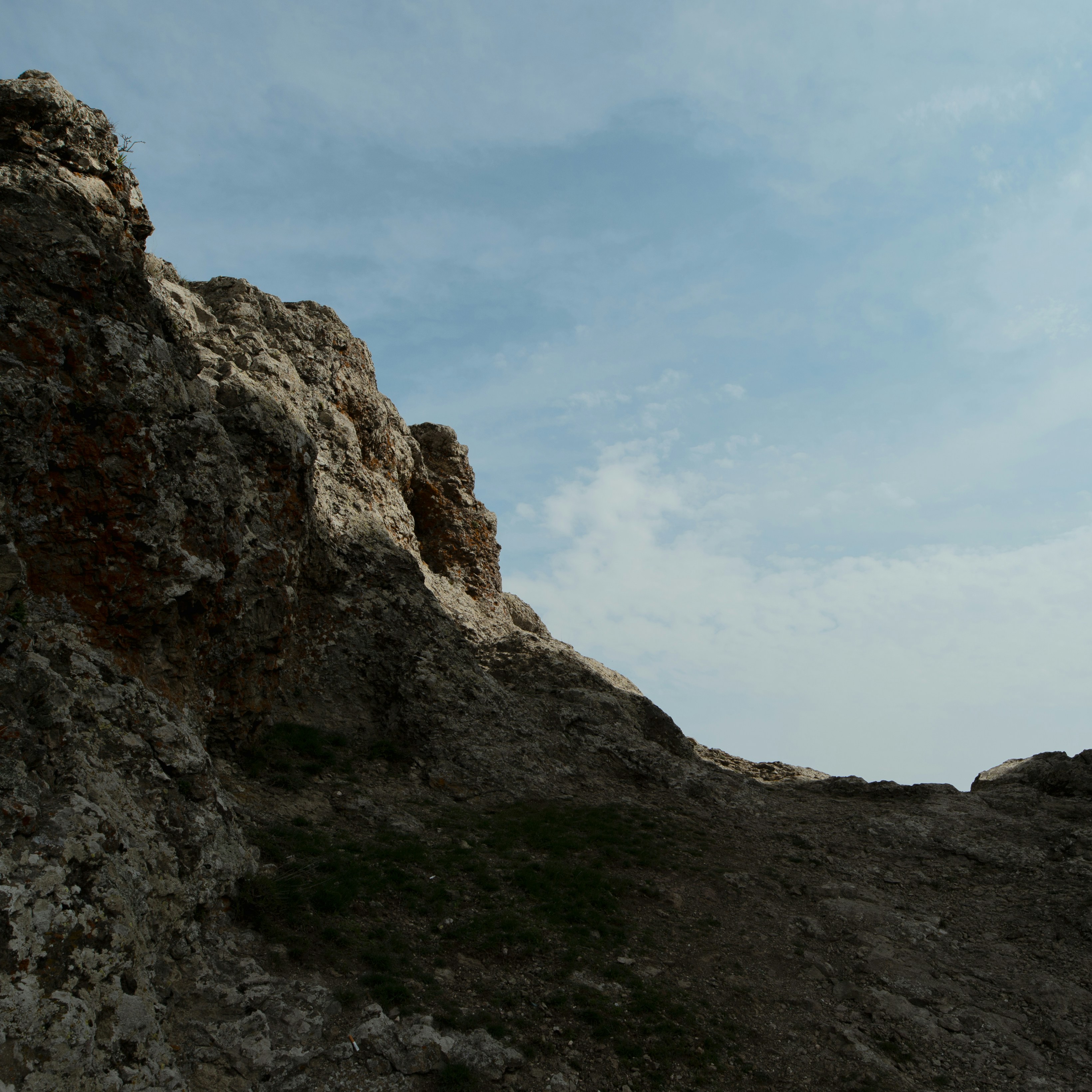 a person standing on top of a rocky hill