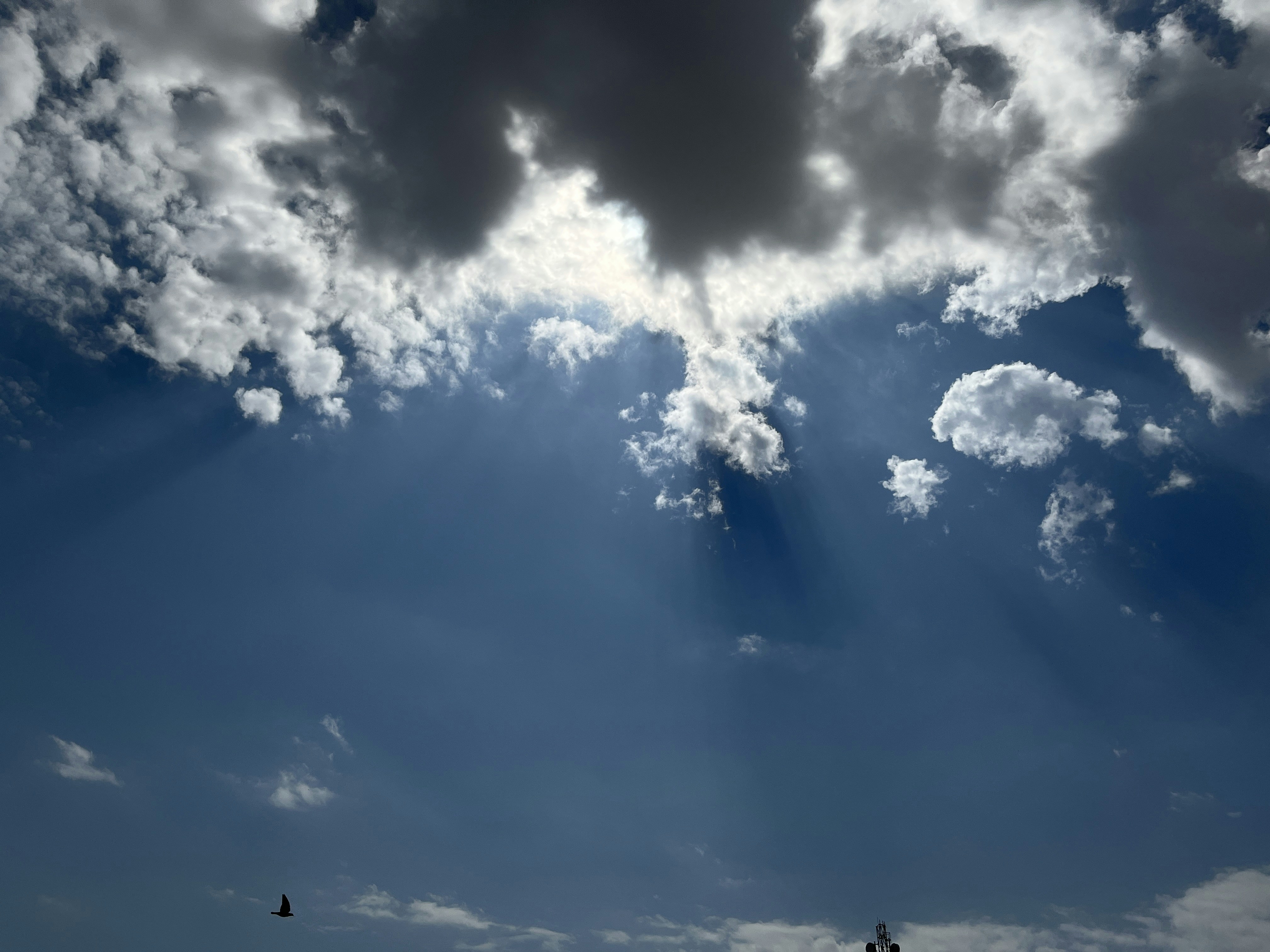 the sun is shining through the clouds in the sky