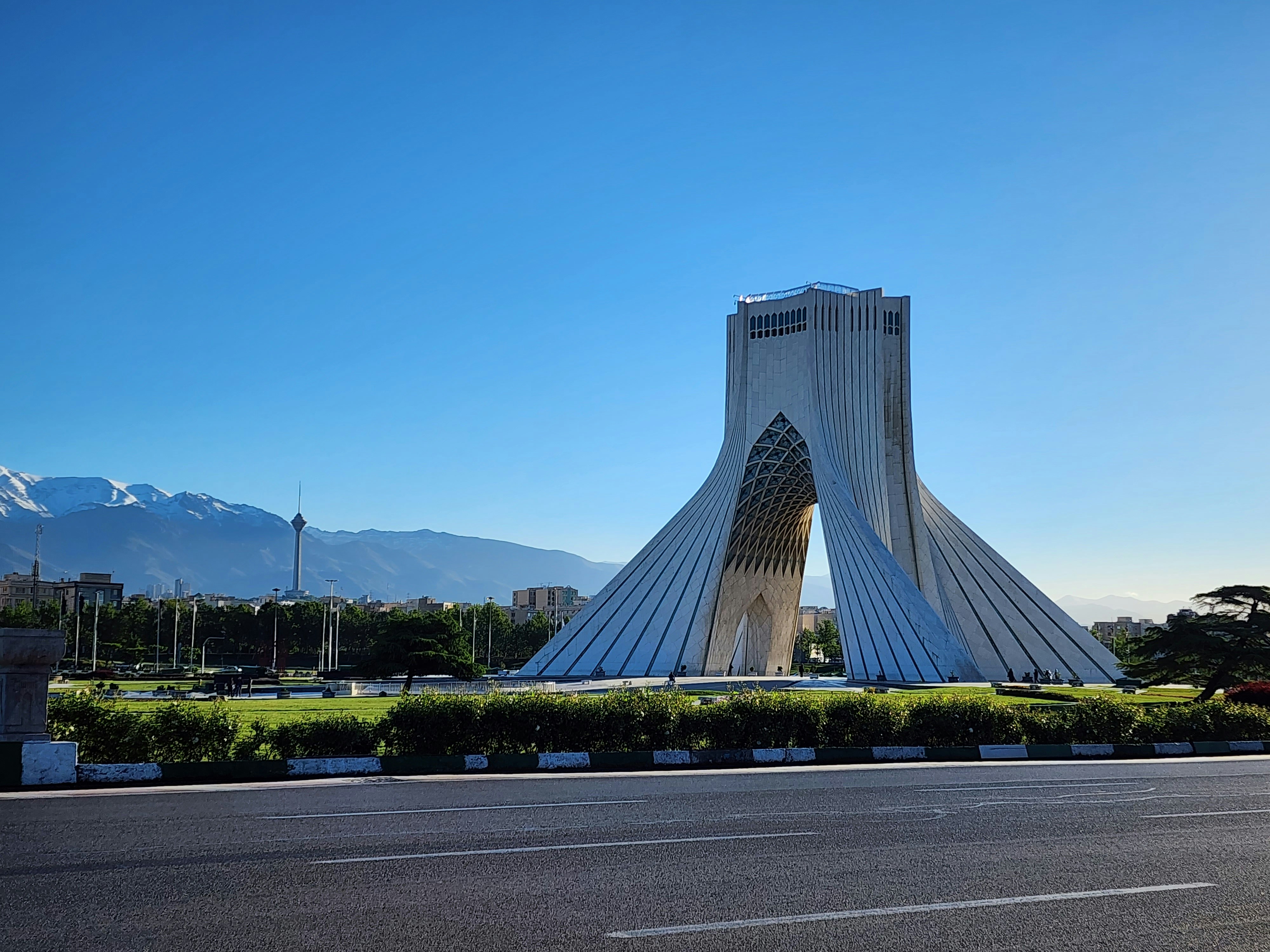 A very tall building with a very tall tower photo – Free Tehran Image ...