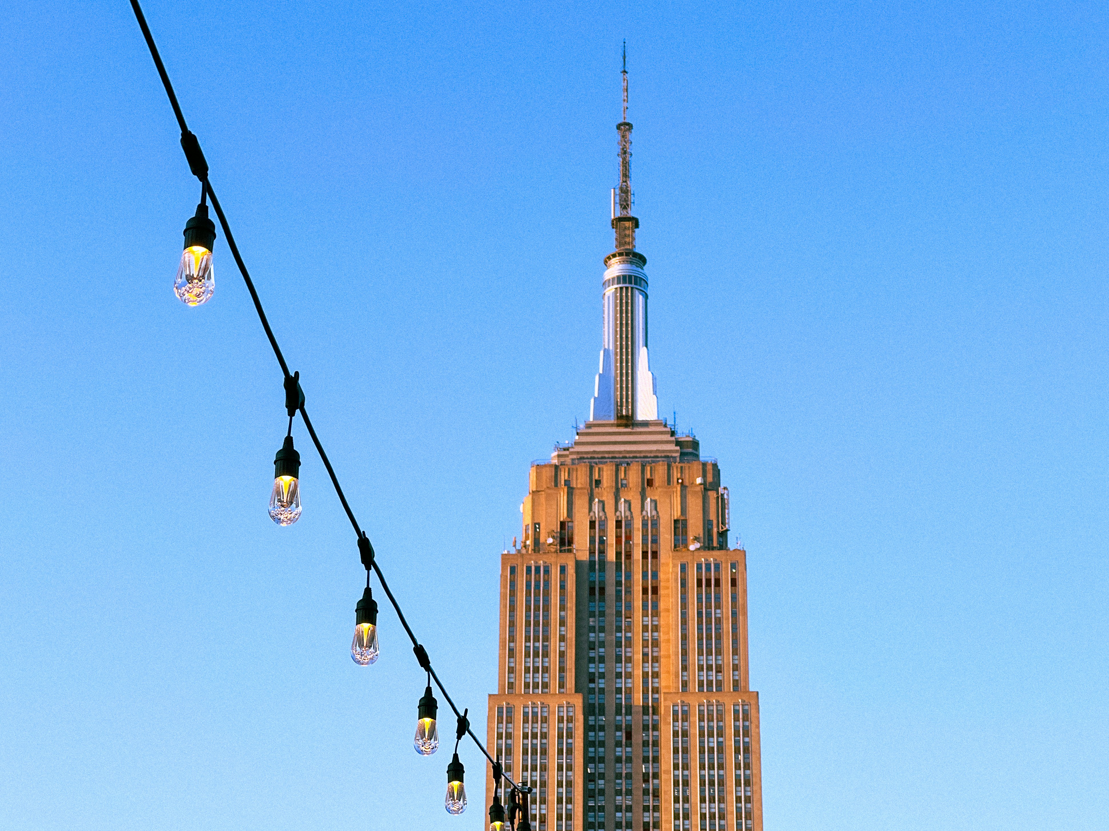 Empire State Glow: Strings of Light Against a Blue Canvas