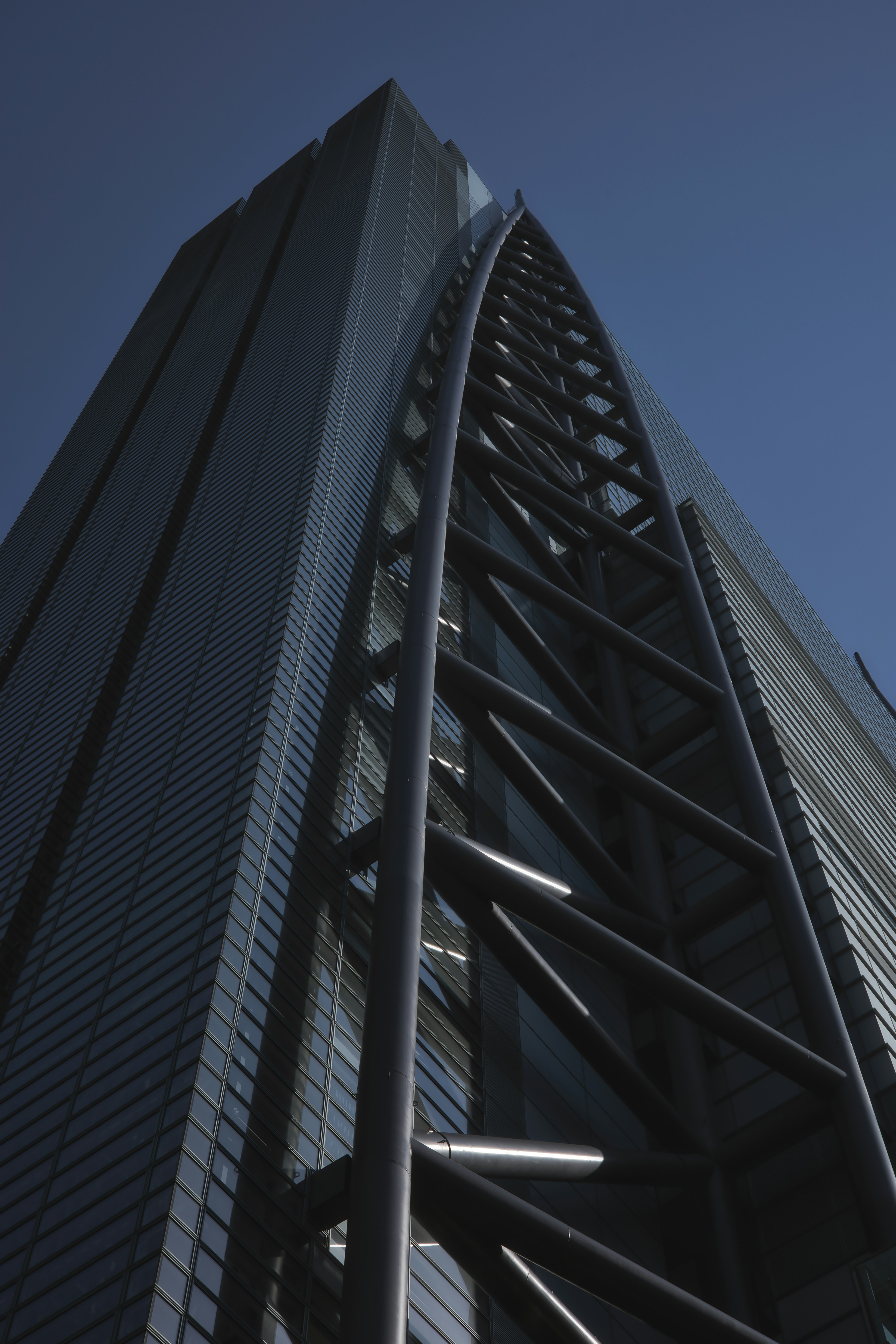 A very tall building with a very tall metal structure photo – Free ...