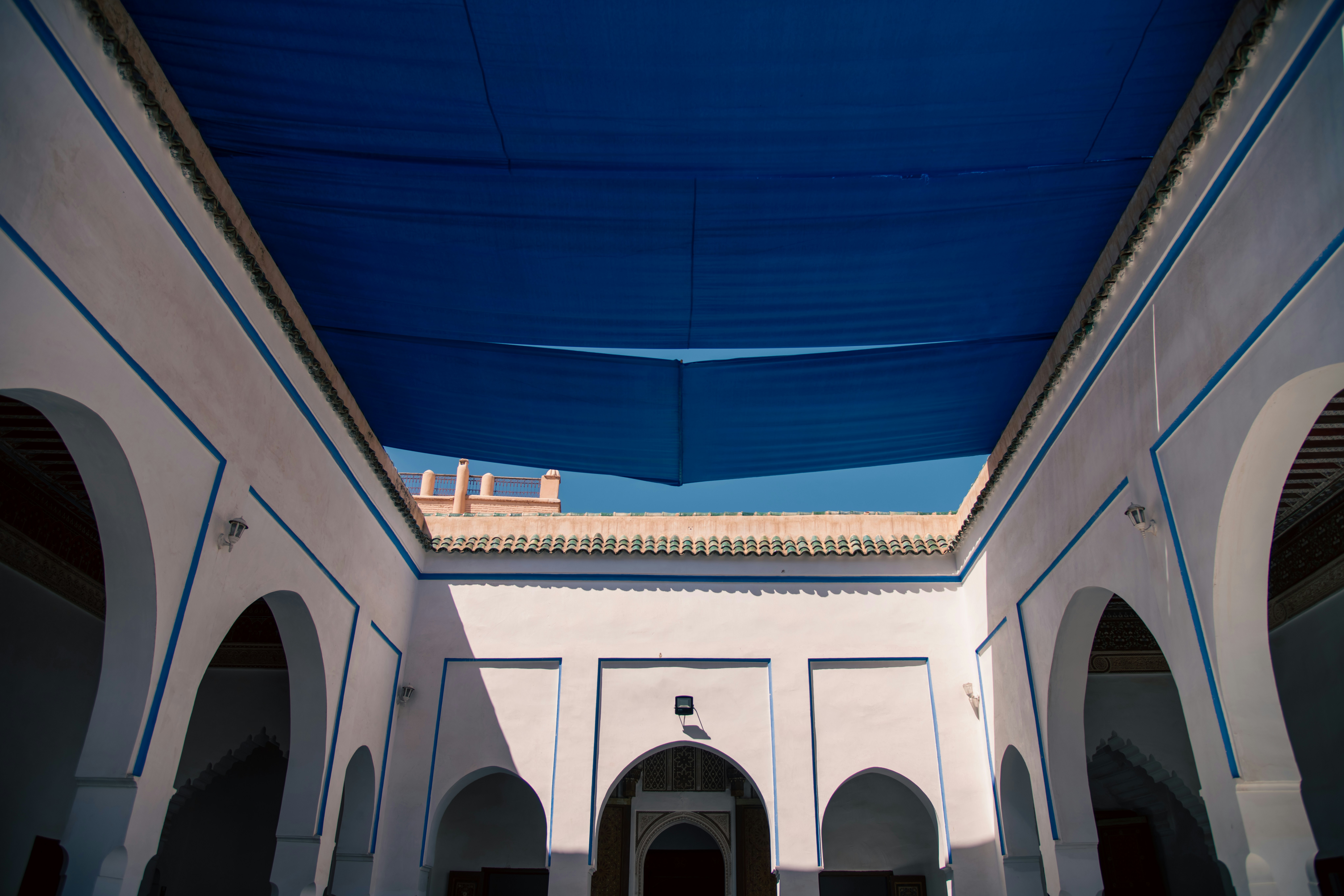 A blue and white building with arches and arches photo – Free Building ...