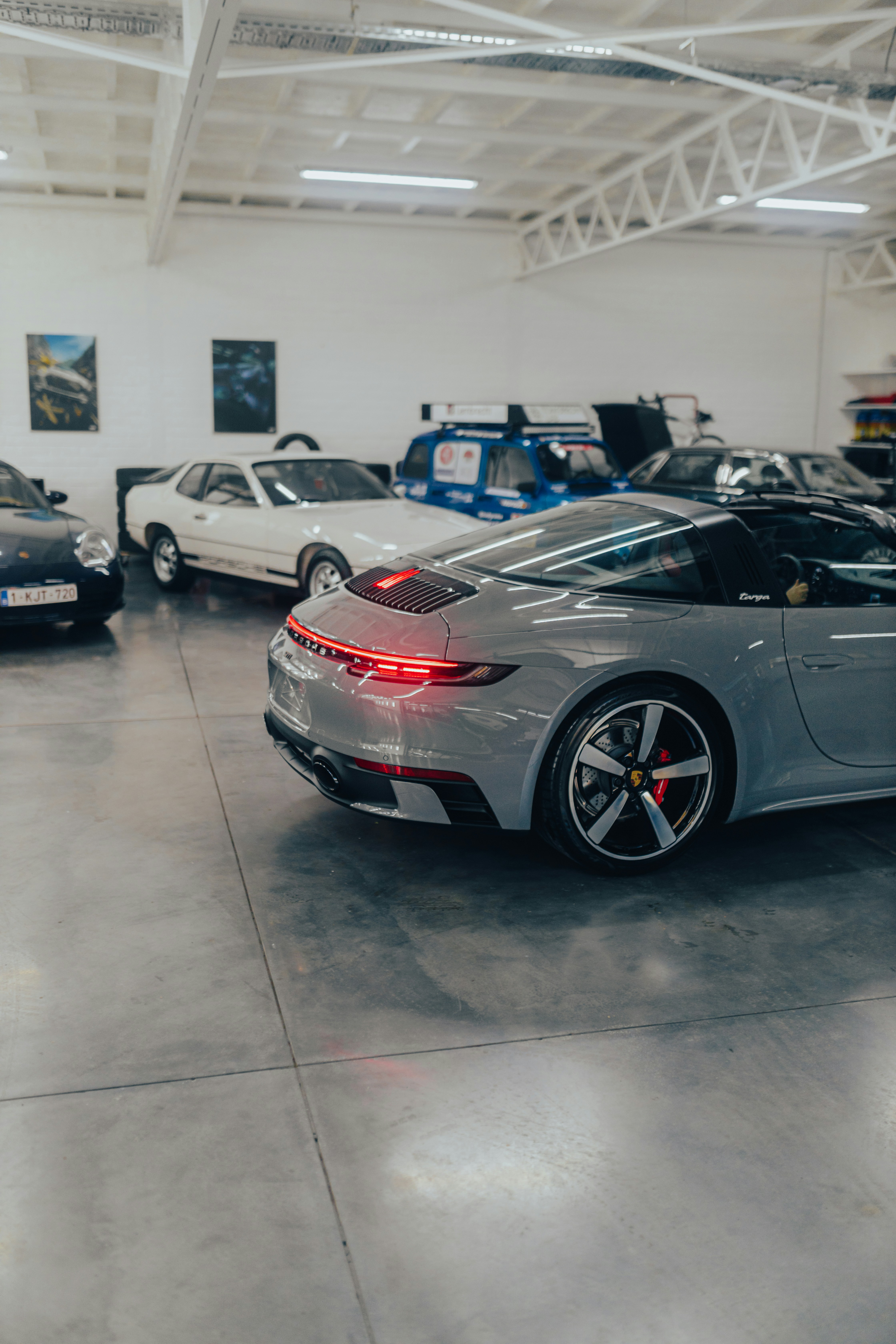 Silver Porsche in a Polished Car Museum