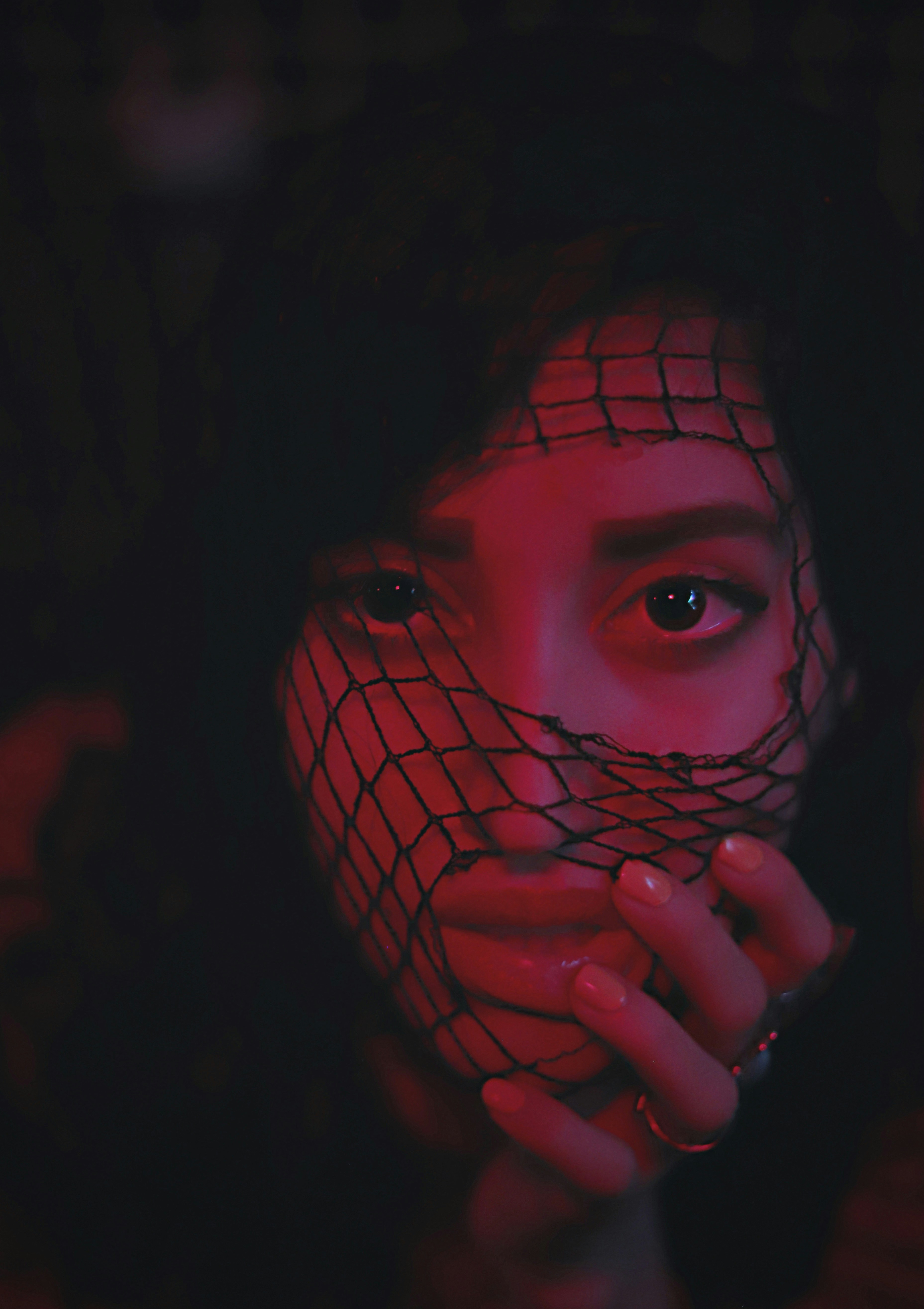 A woman with a net covering her face photo – Free Finger Image on Unsplash
