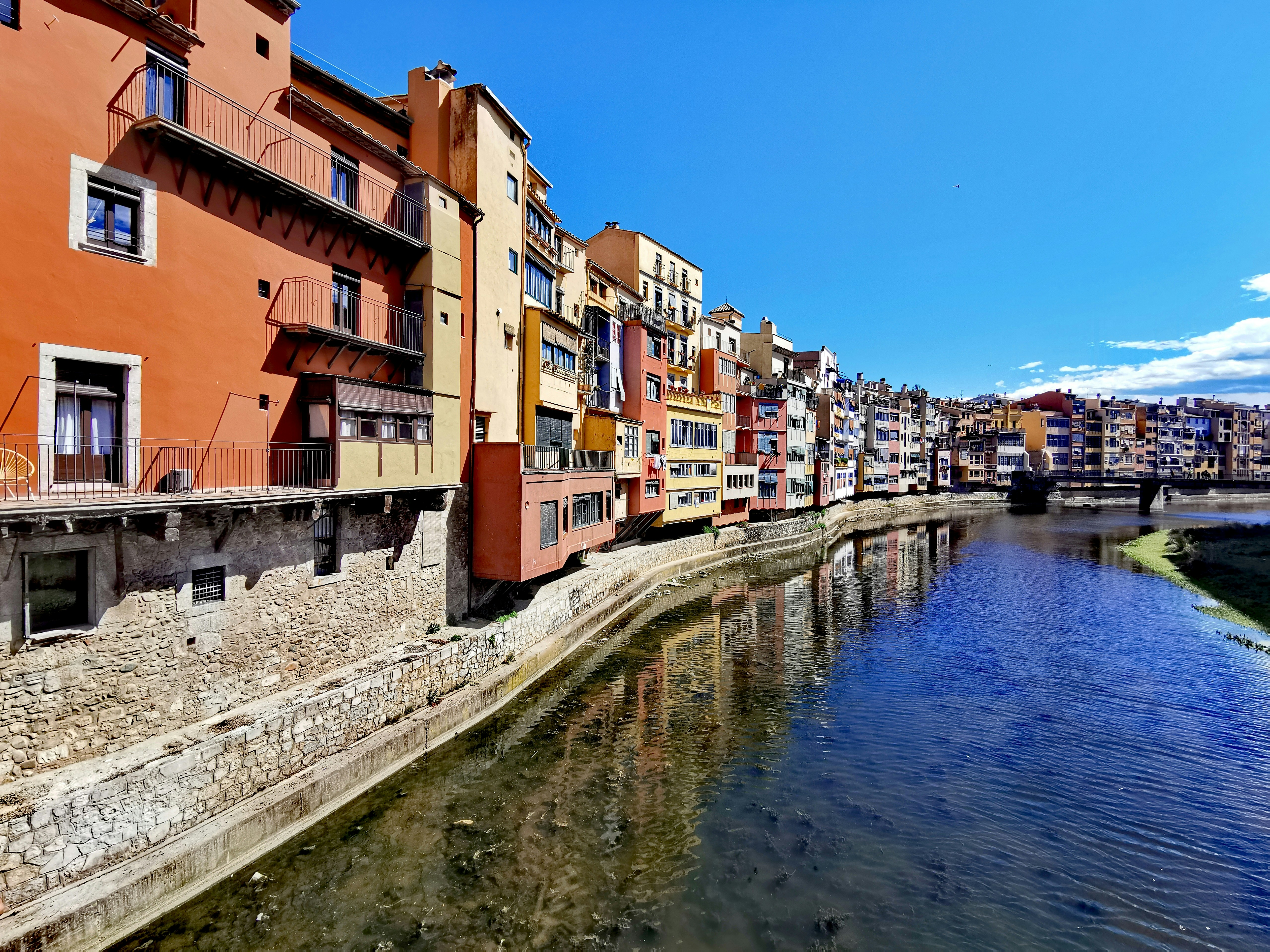 Riverside Patchwork: Colorful Facades Framing a Calm Canal
