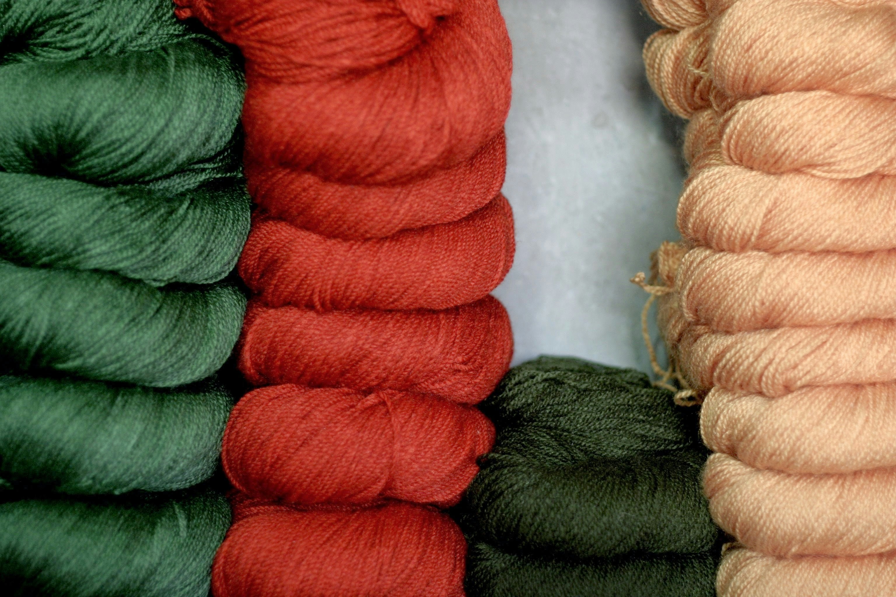 Color-Stacked Skeins: A Close-Up Study of Green, Red, and Sand