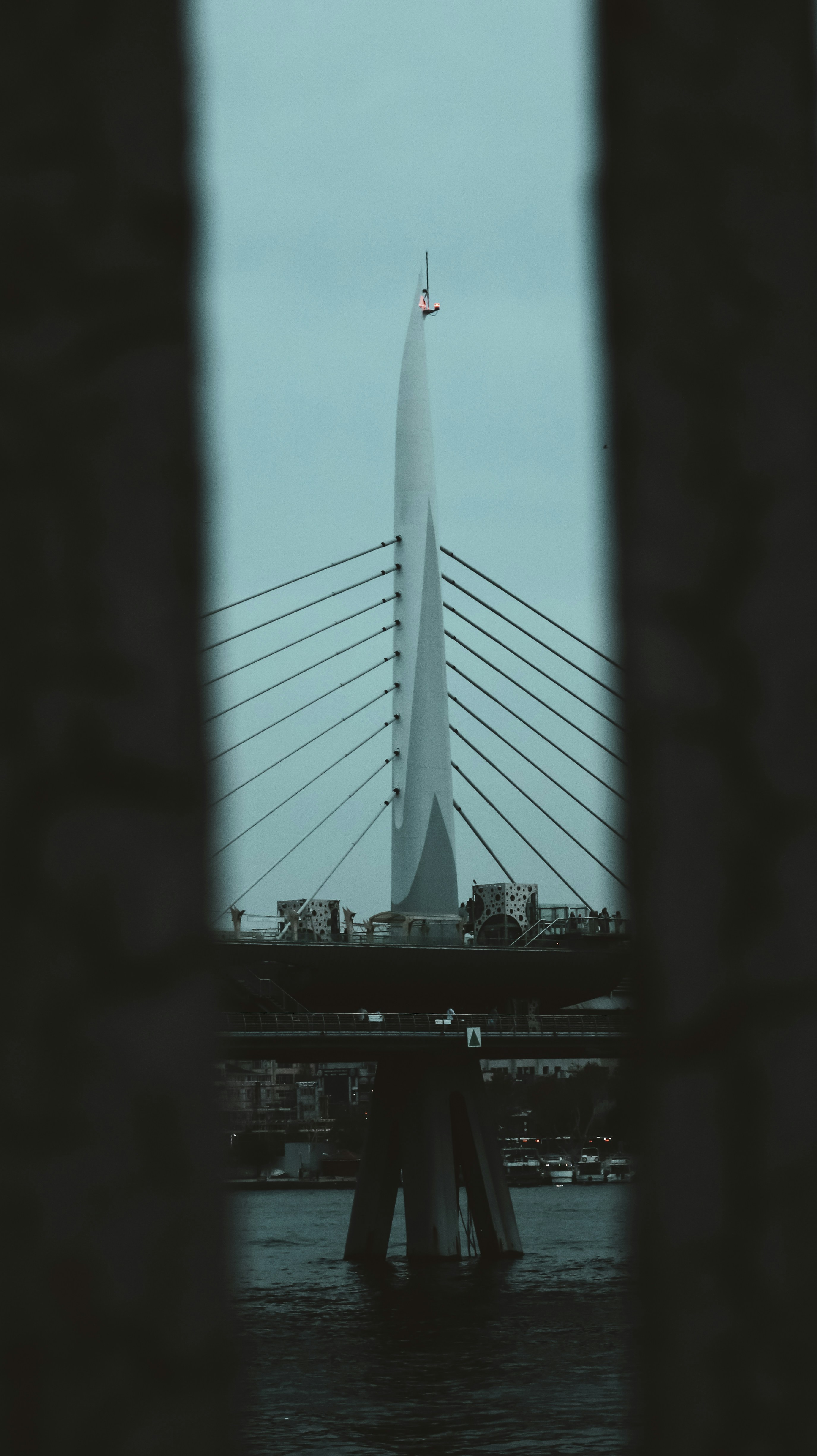 Through the Framed Gap: The Needle-Spire of a Cable-Stayed Bridge