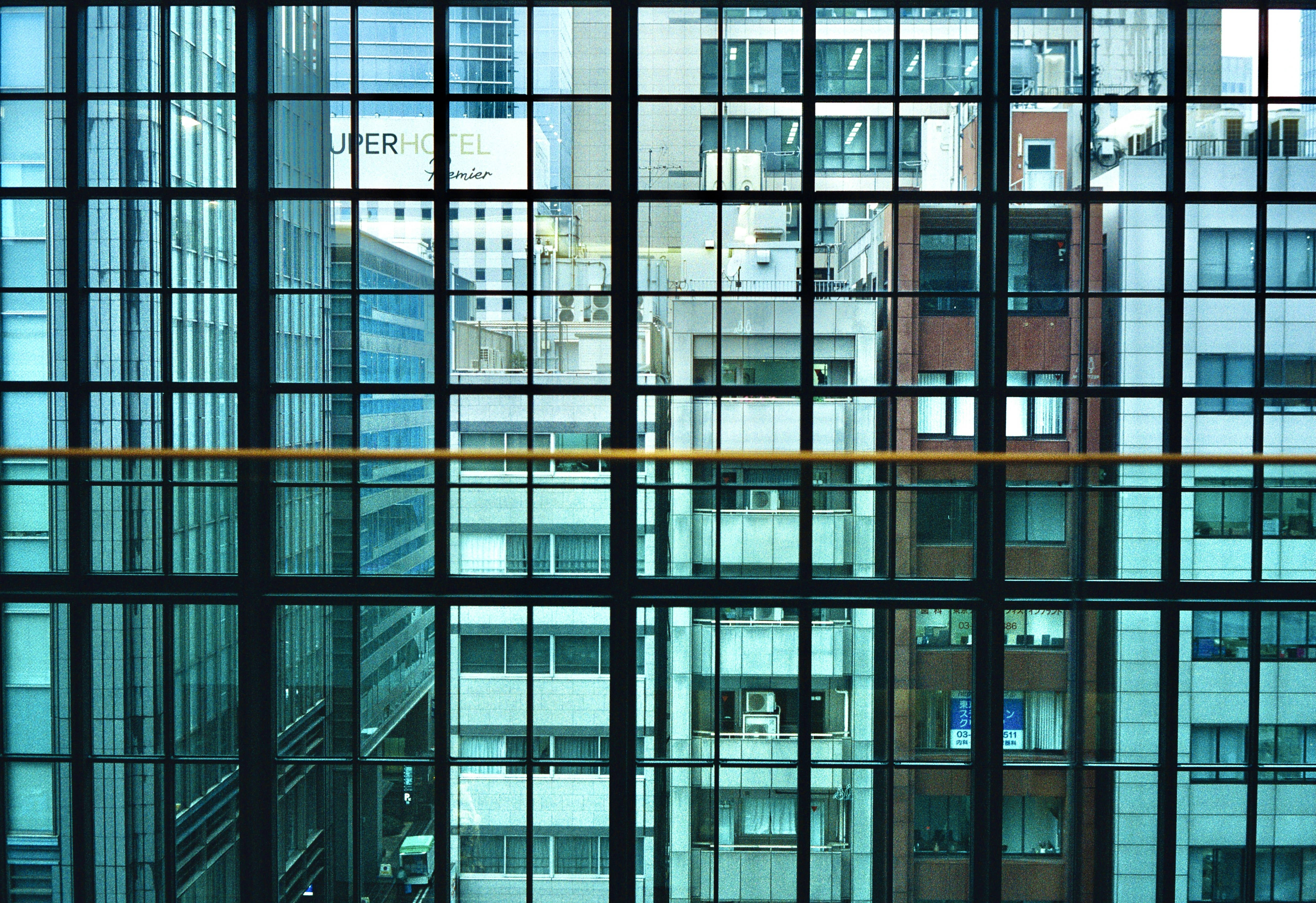 A view of a city from a high rise window photo – Free 35mm film Image ...