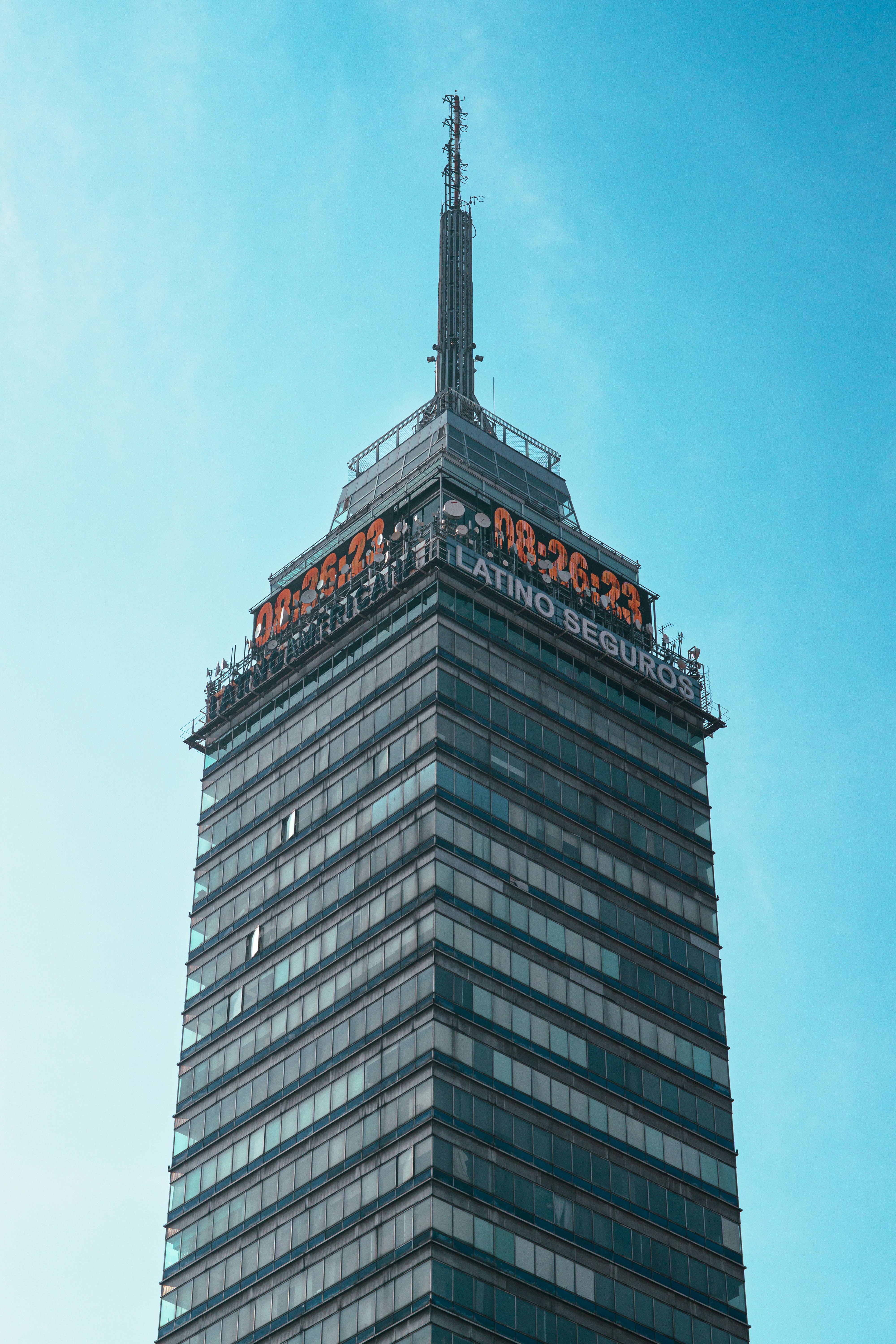 Spire Ascendant: Torre Latinoamericana Pierces a Clear Blue Sky