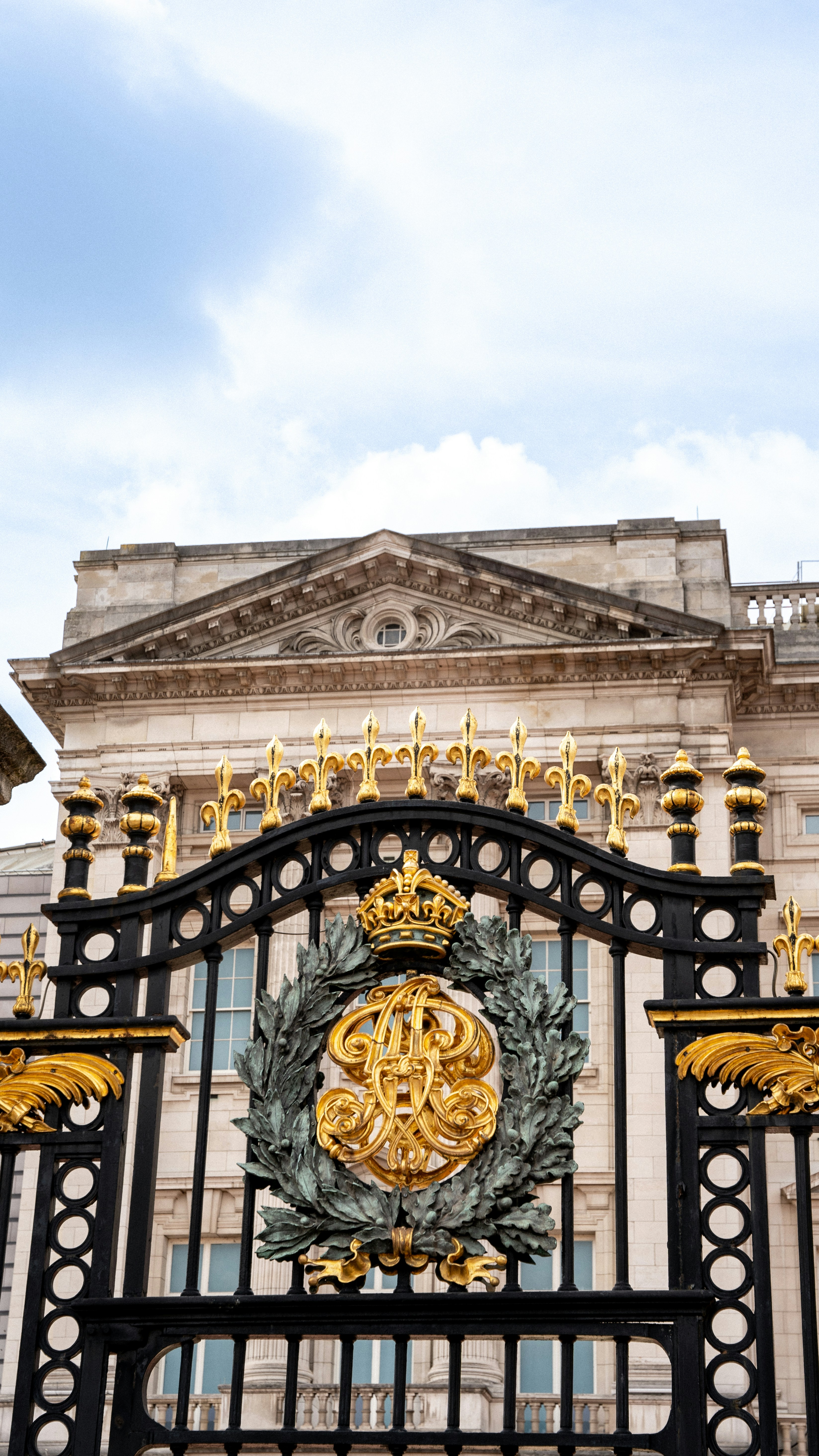 A black and gold gate with a crown on it photo – Free Uk Image on Unsplash