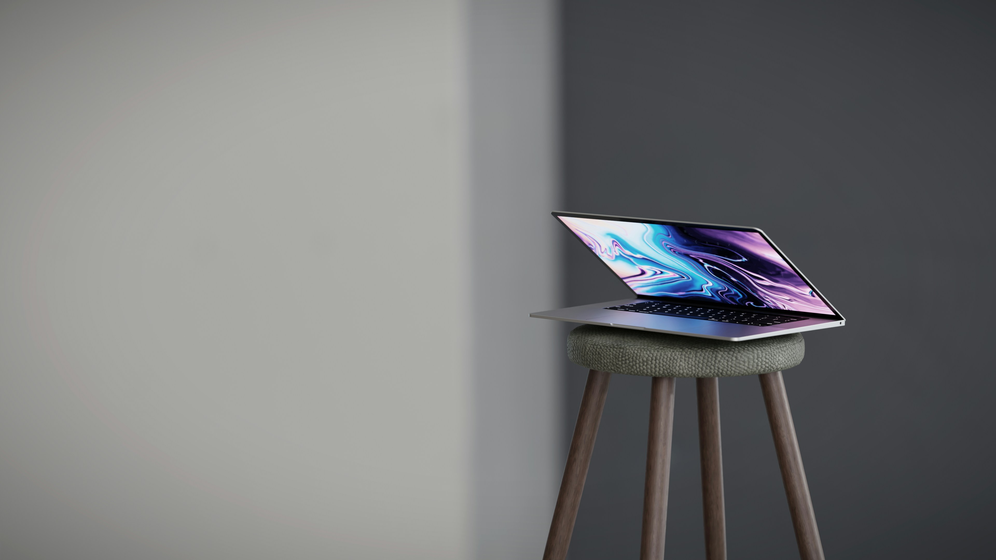 A laptop sitting on a stool in a room photo – Free Laptop Image on Unsplash