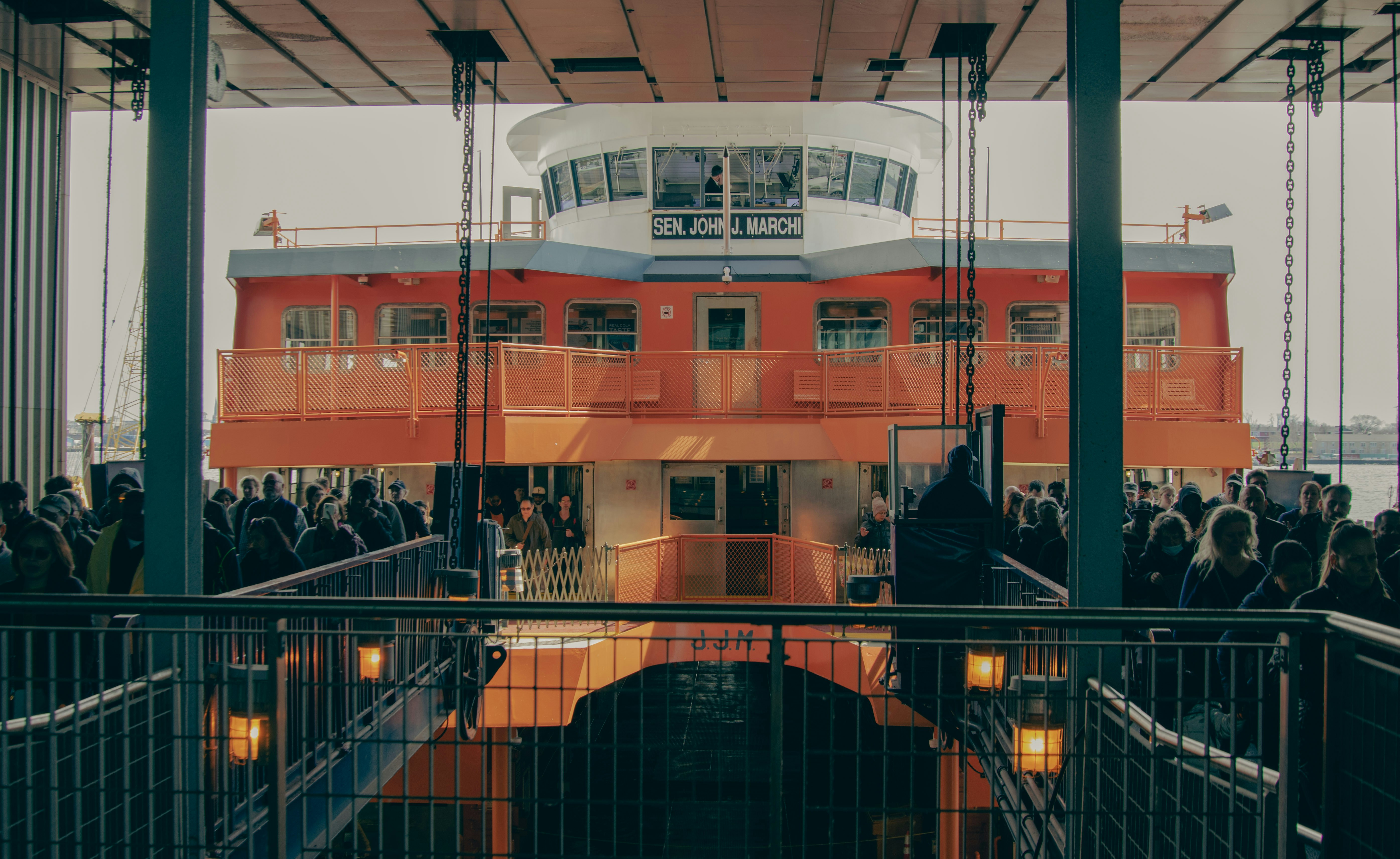 Midship on the Orange Ferry: People, Steel, and Sunset Light