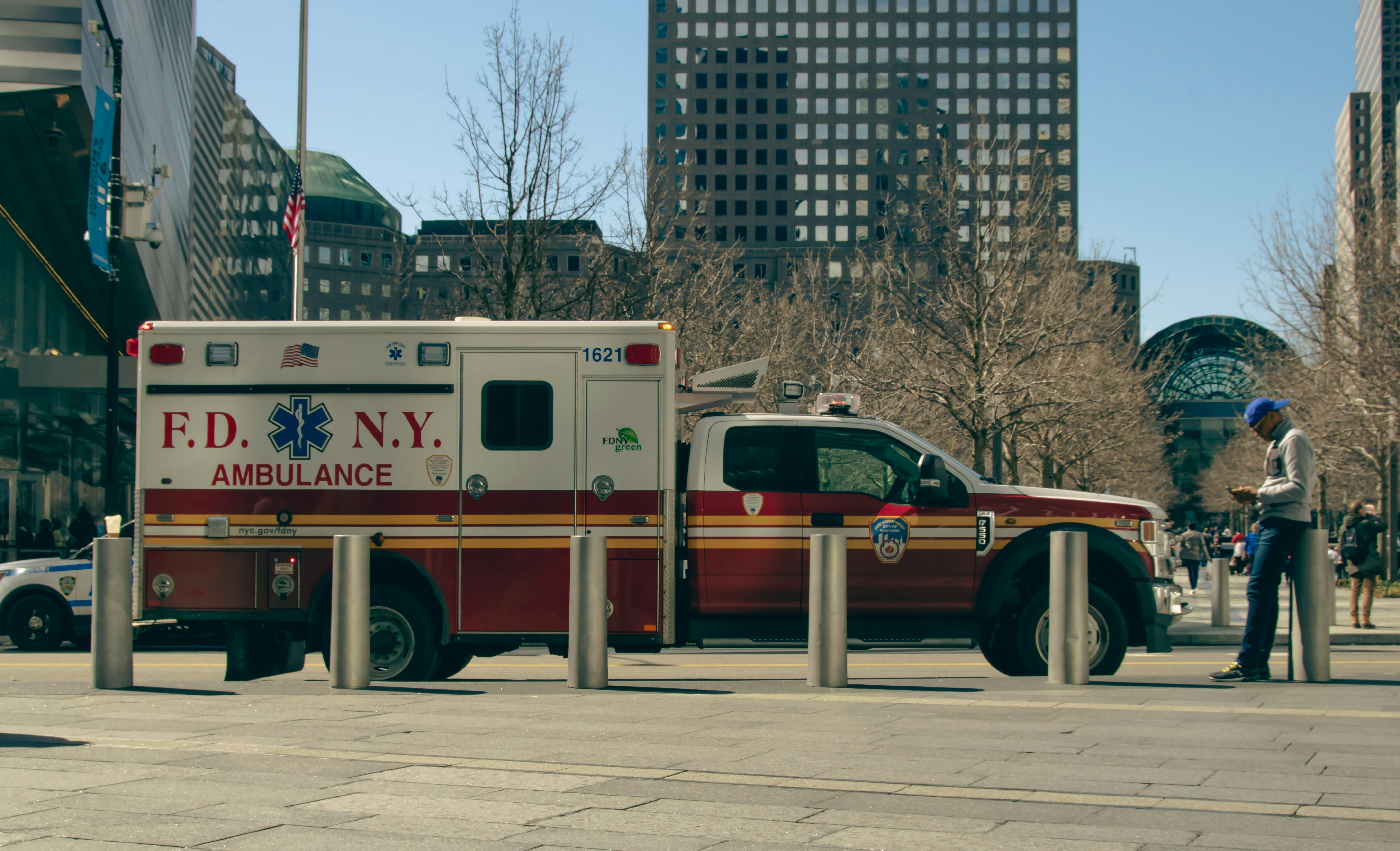 An ambulance is parked on the side of the road photo – Free Car Image ...