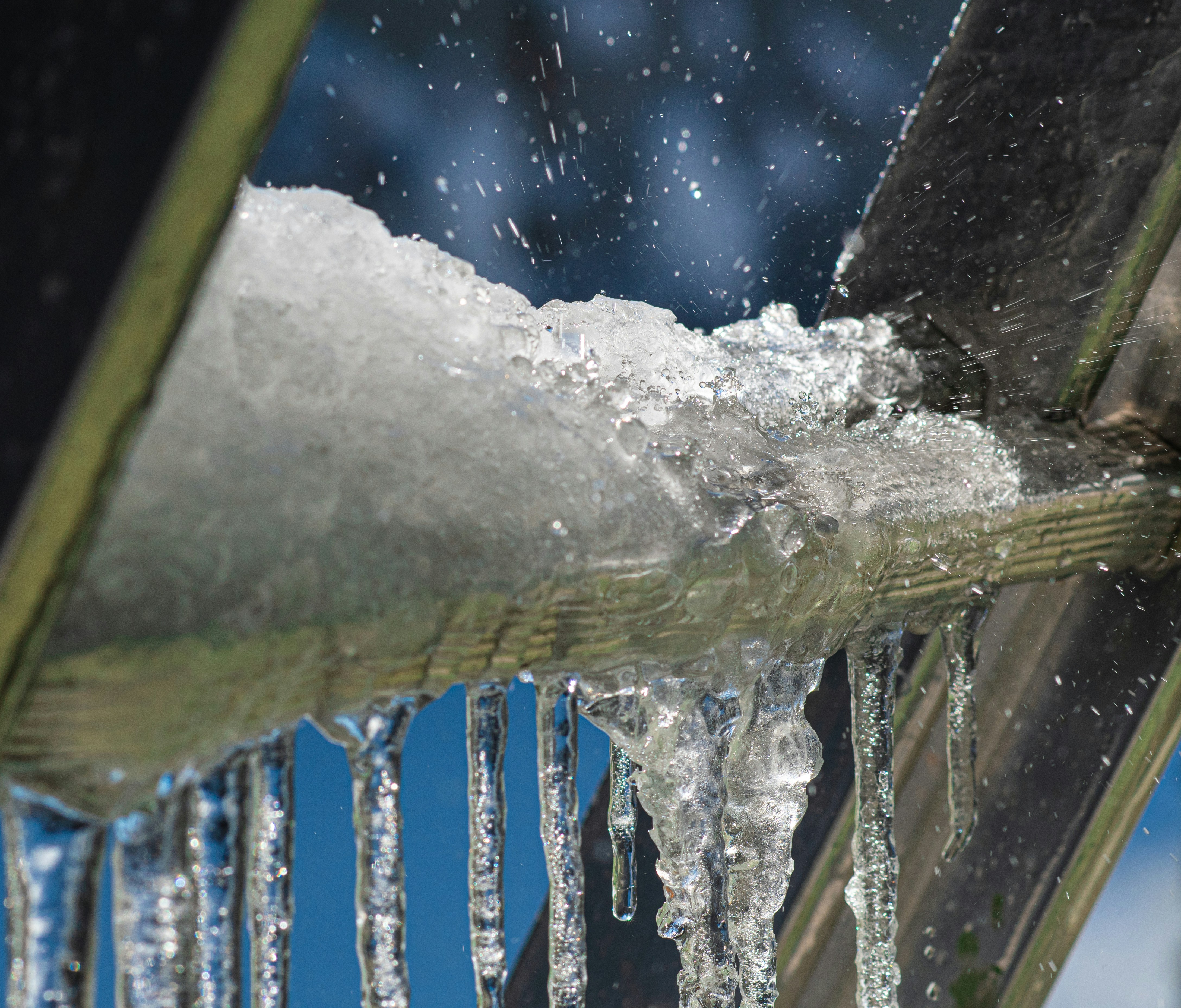 Icicles in a Blue Sky: Fractured Light on a Snow-Capped Beam