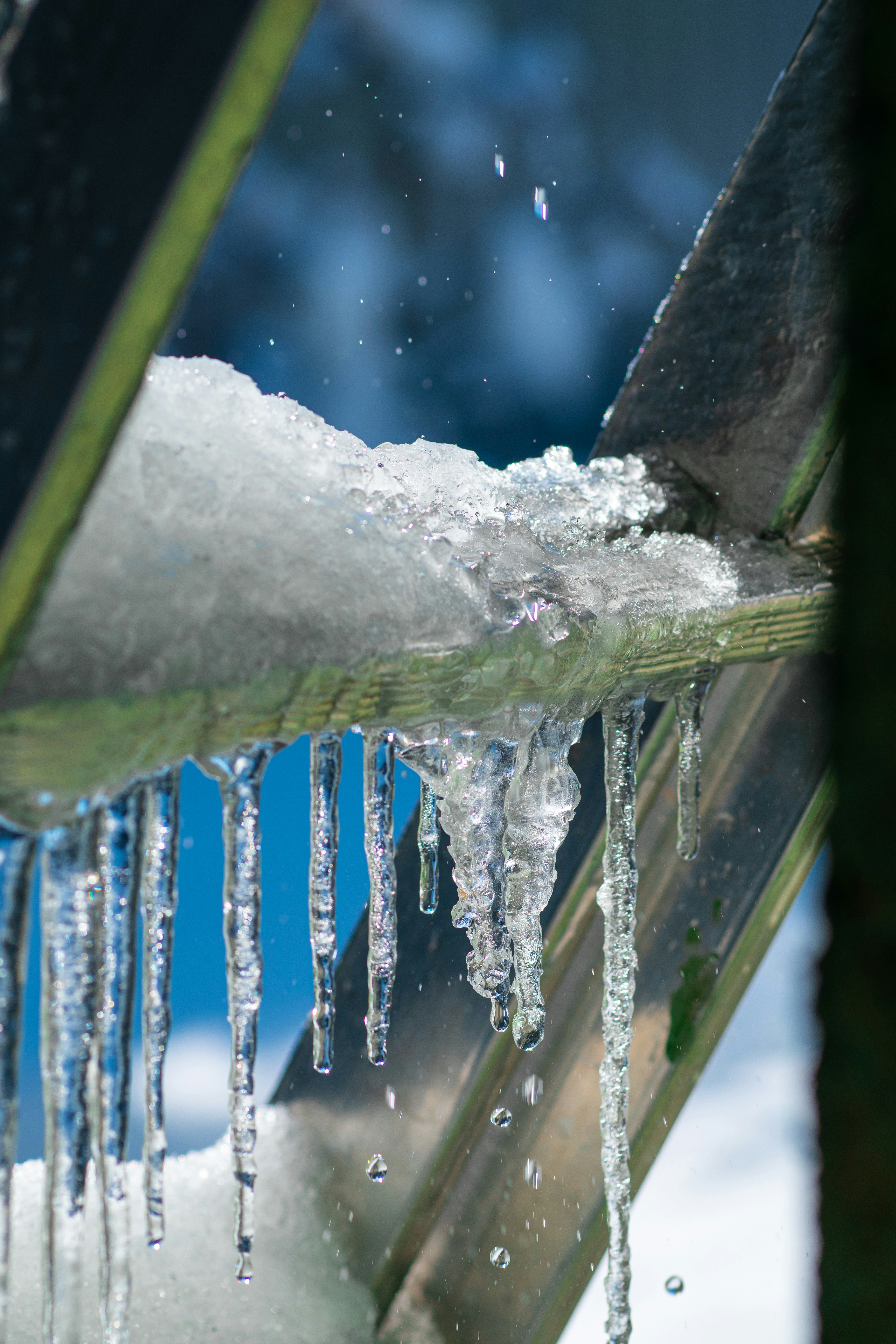 Icicles hanging from a gutter gutter gutter gutter gutter gut photo ...