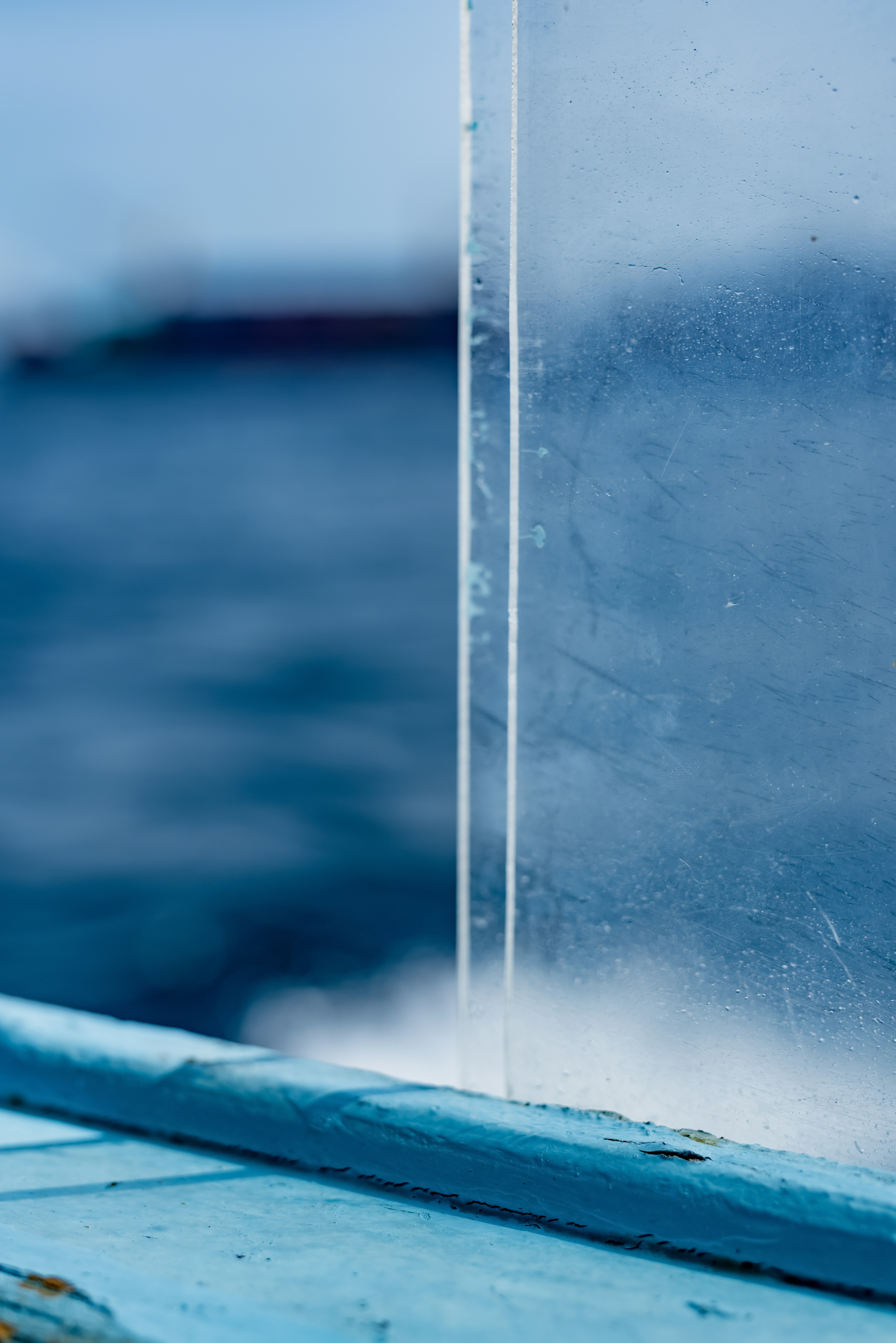 A close up of a window with water in the background photo – Free Travel ...