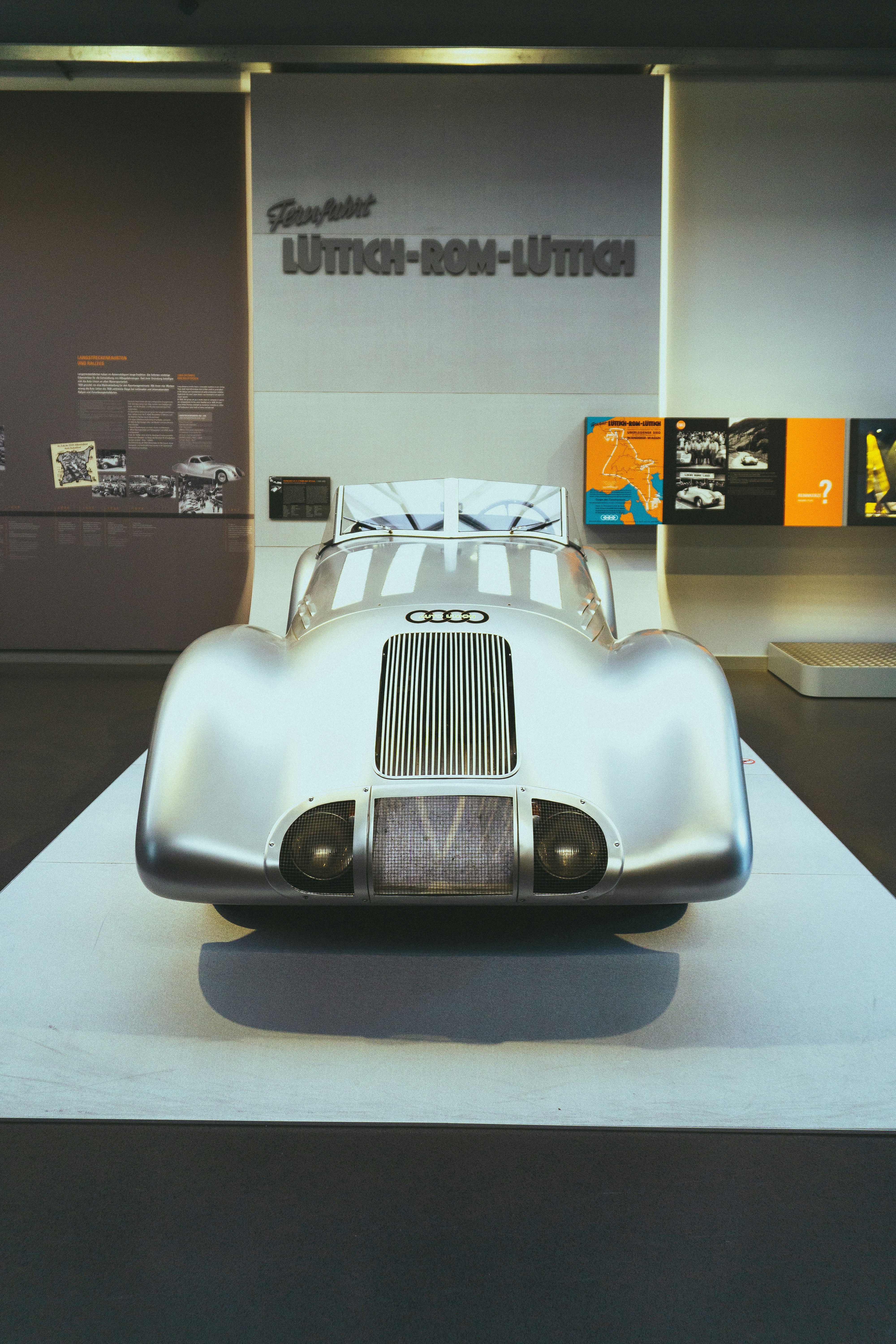 a car is on display in a museum