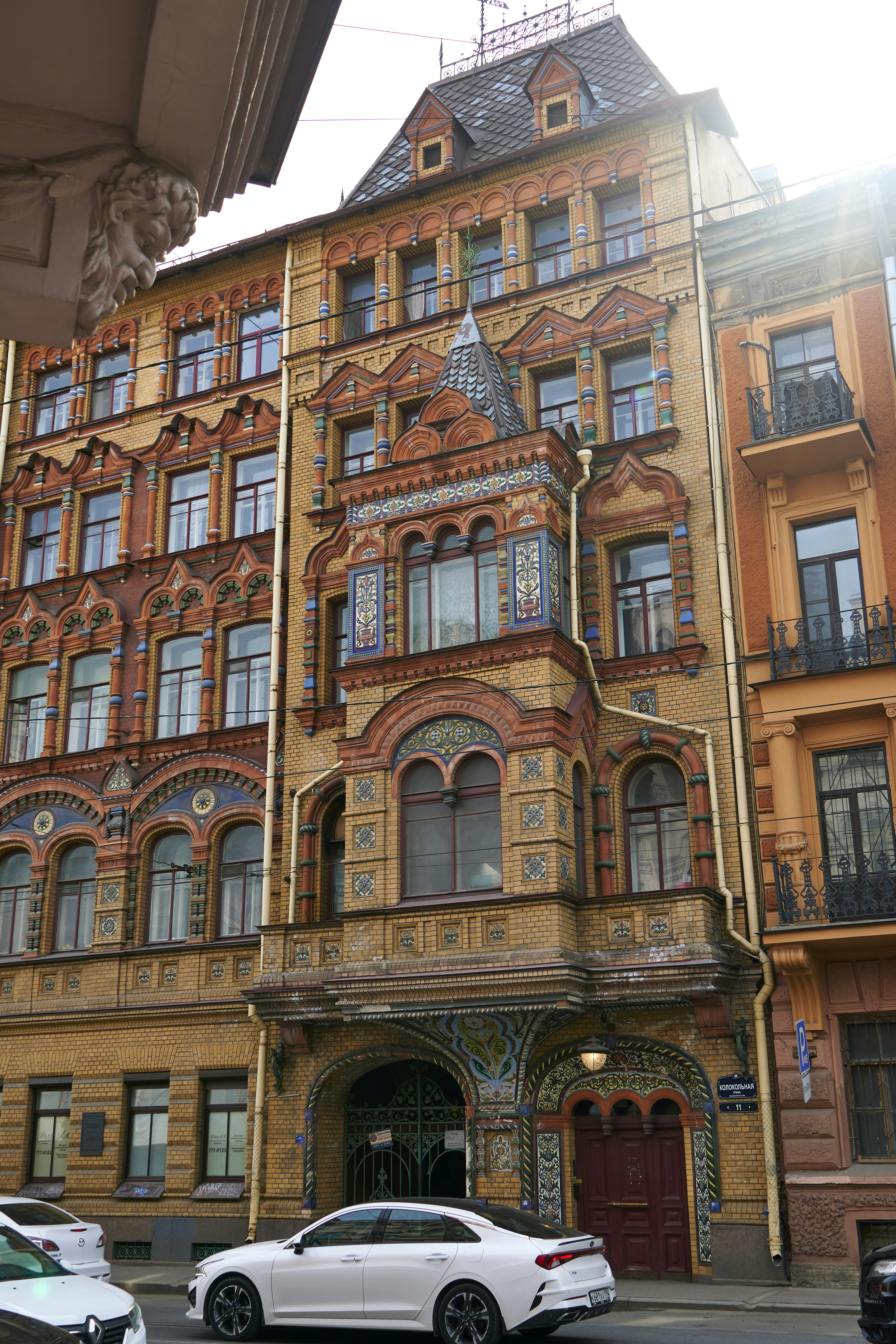 Ornate Facade of a Red-Brick Urban Landmark