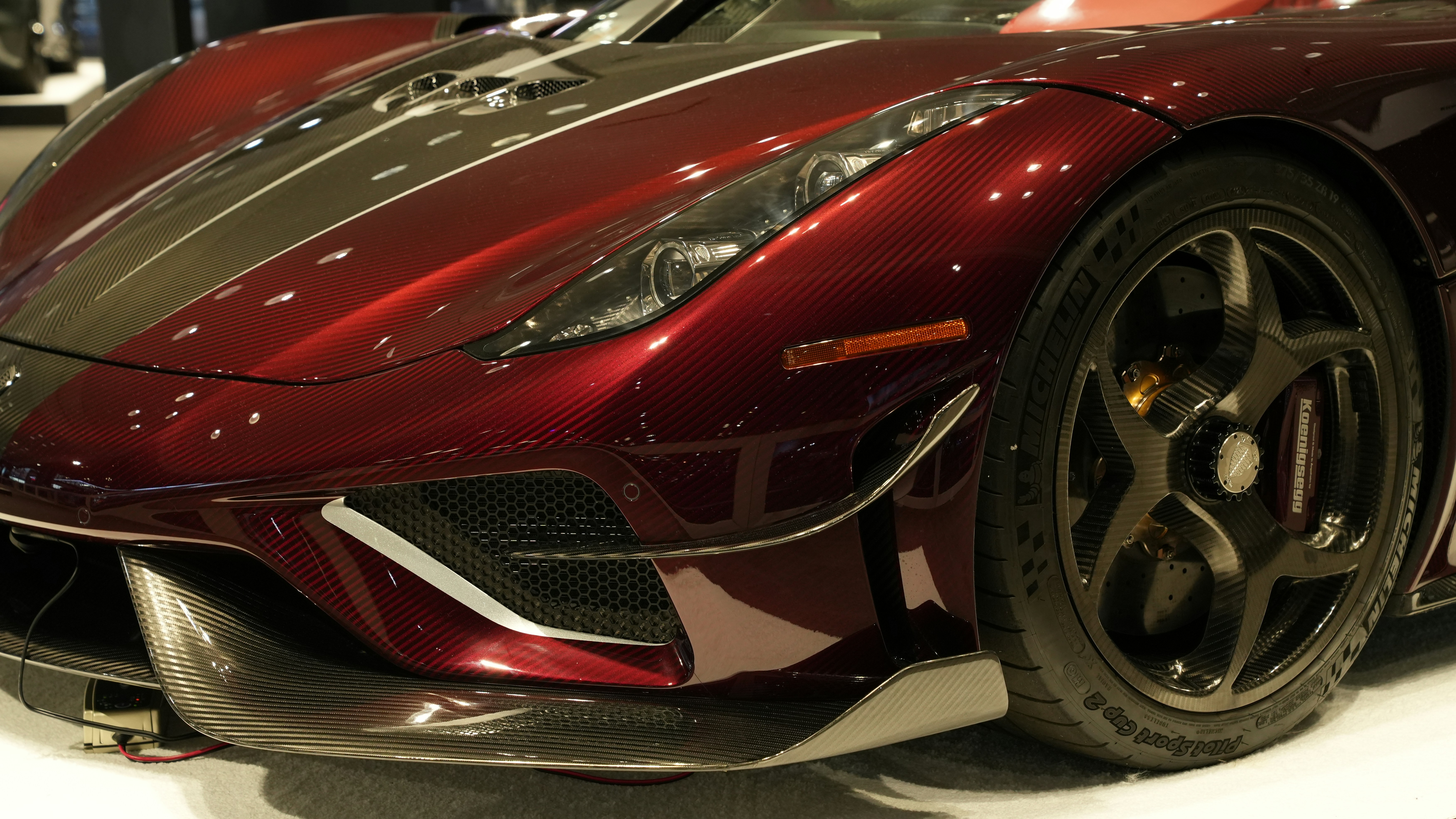 A close up of a red sports car on display photo – Free Hypercar Image ...
