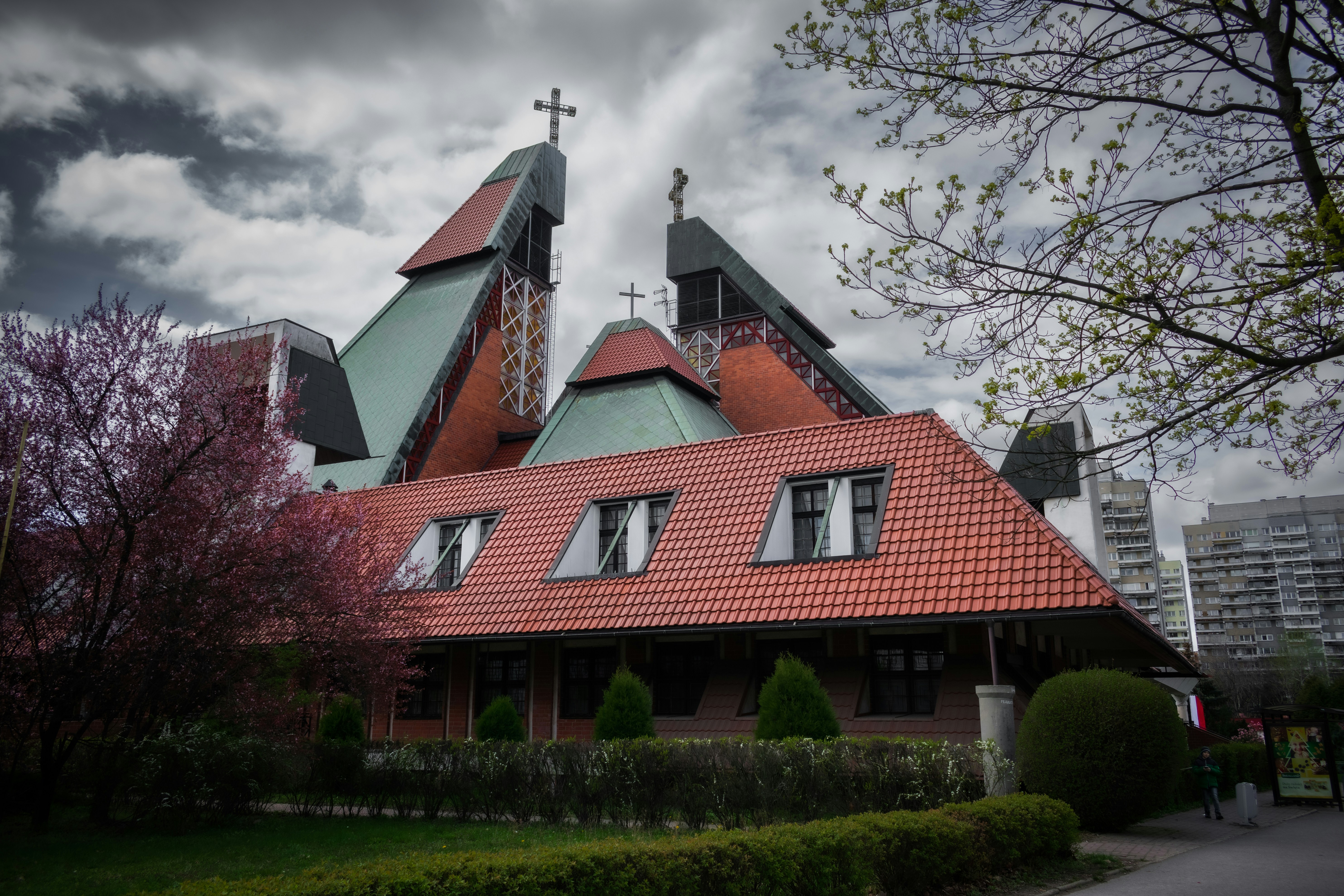 Angles of Faith: A Modern Cathedral with Fire-Red Roofs