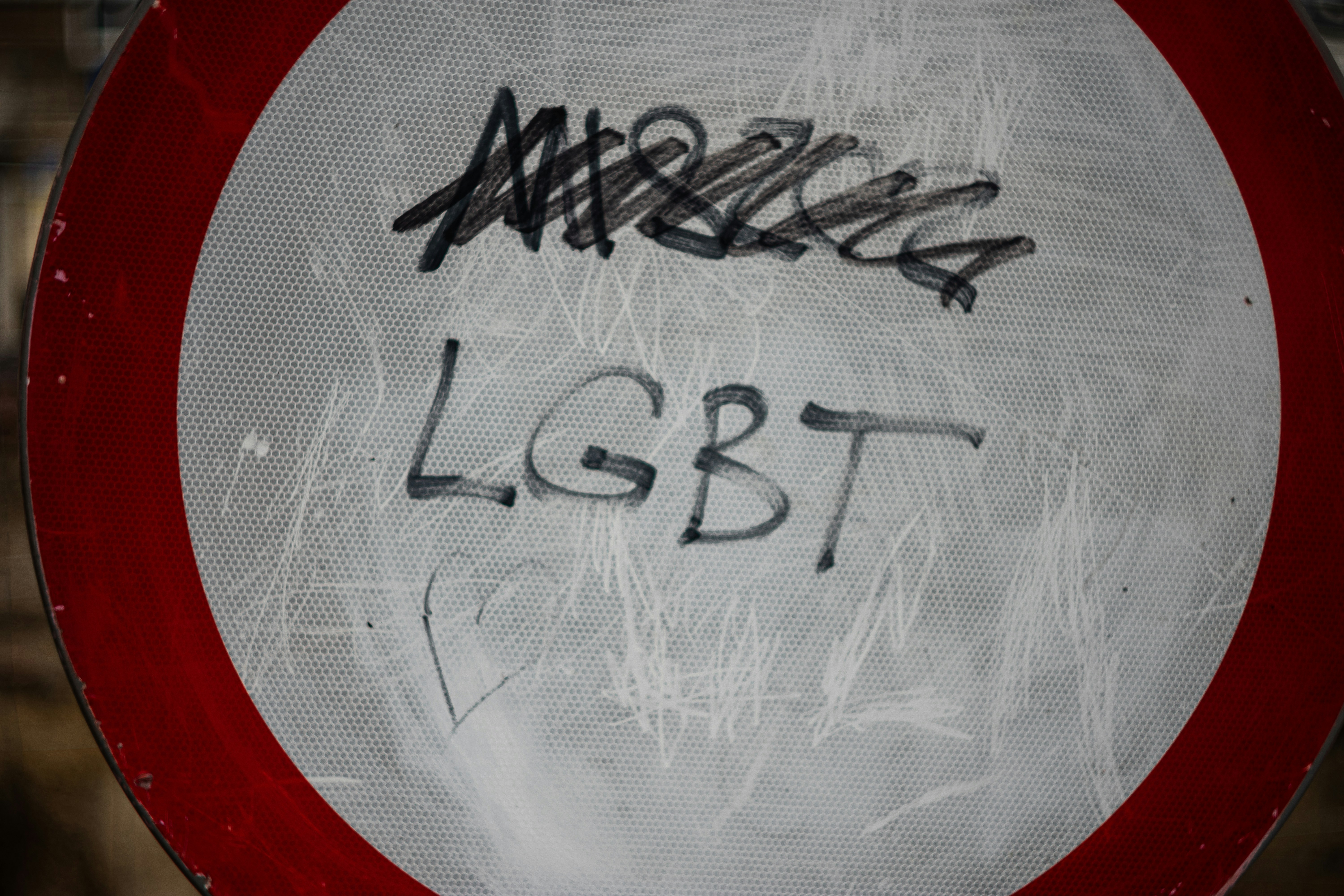 A close up of a street sign with graffiti on it photo – Free Text Image ...