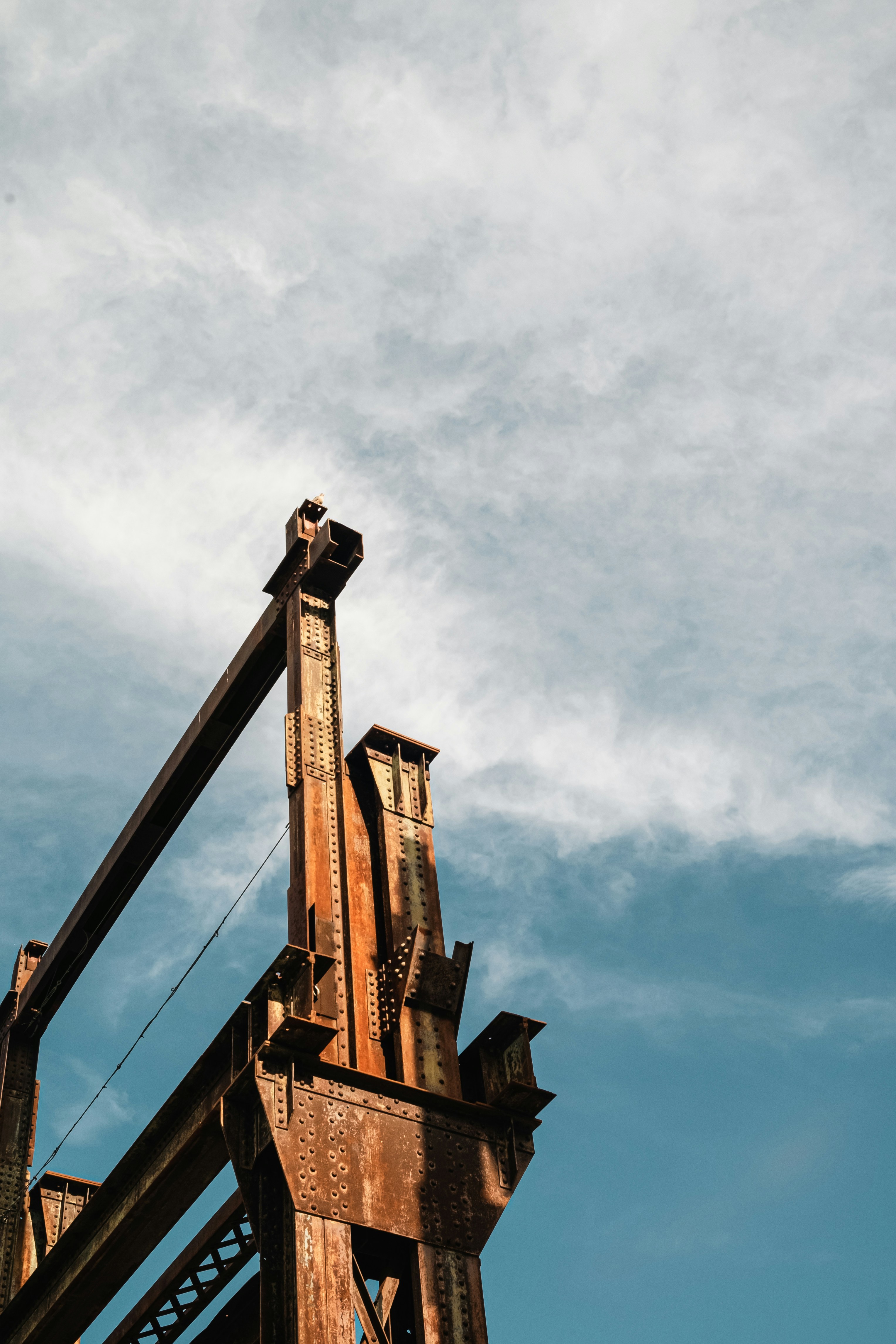 Rust and Sky: A Crane’s Grit on a Quiet Day