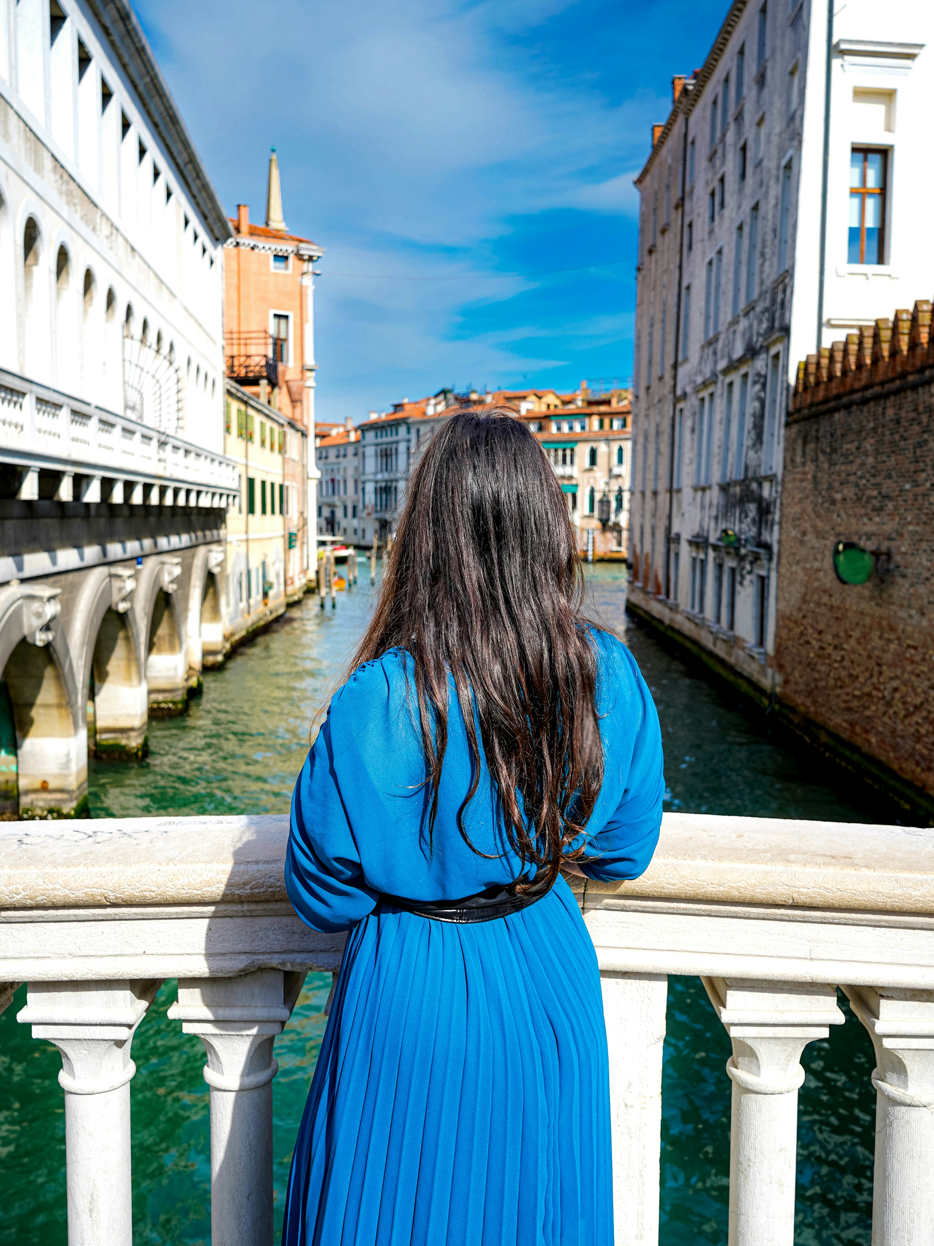 Blue Gown on a Venetian Bridge: A Quiet Portrait Over the Canal