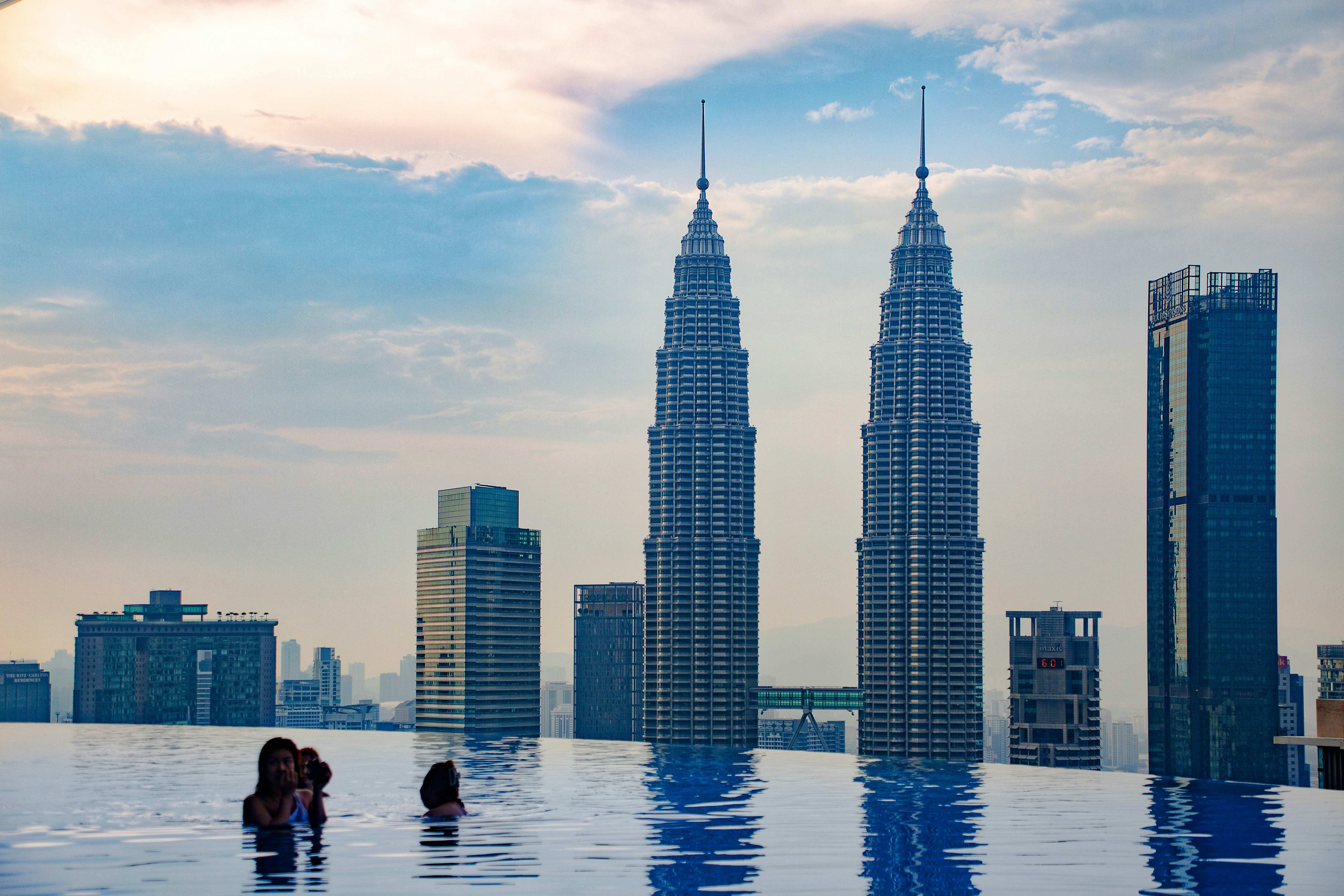 The infinity pool on the roof of a luxury apartment with a beautiful view of Petronas Twin Towers, the former highest building in the world.