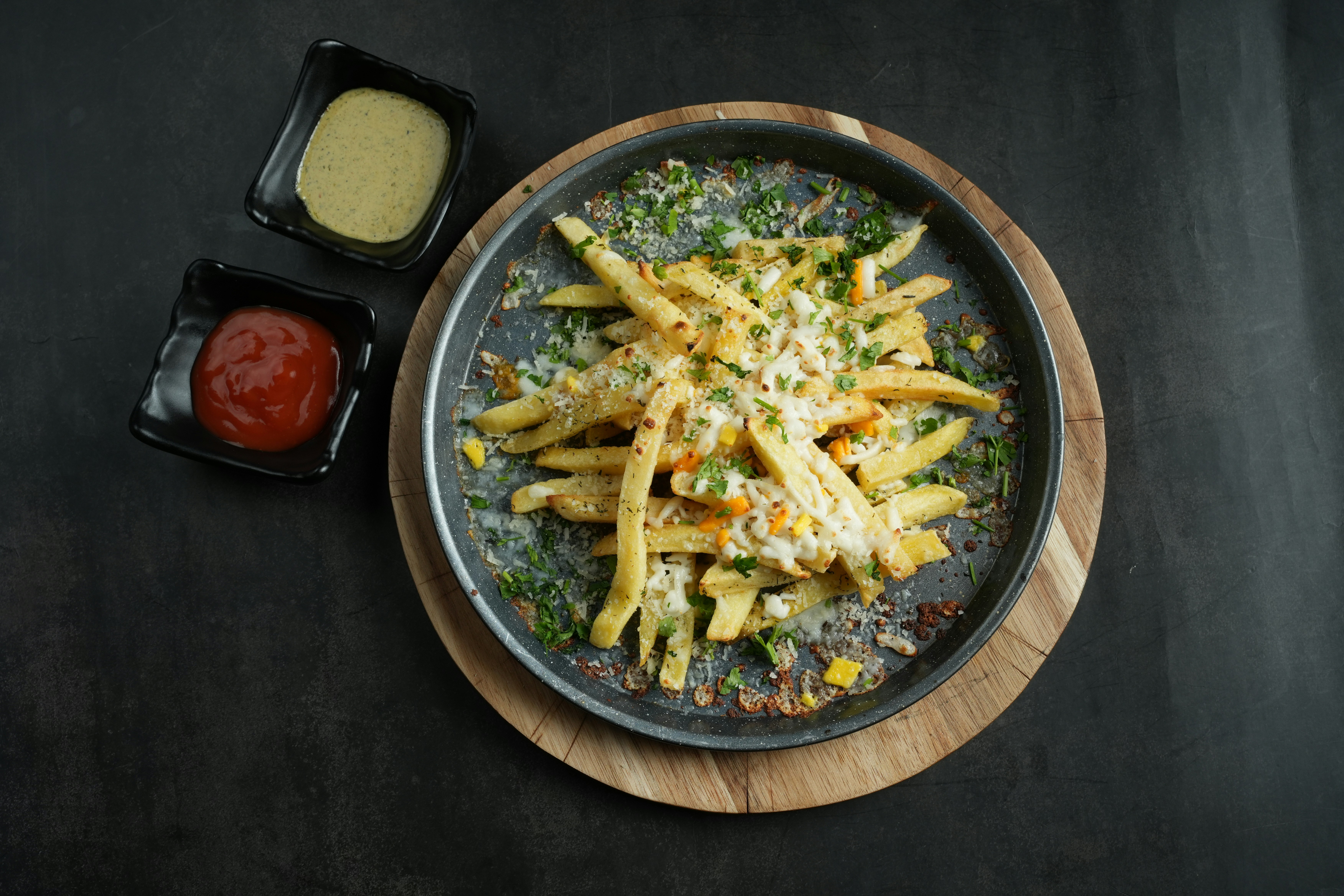 Herb-Kissed Fries Crowned on a Sizzling Skillet