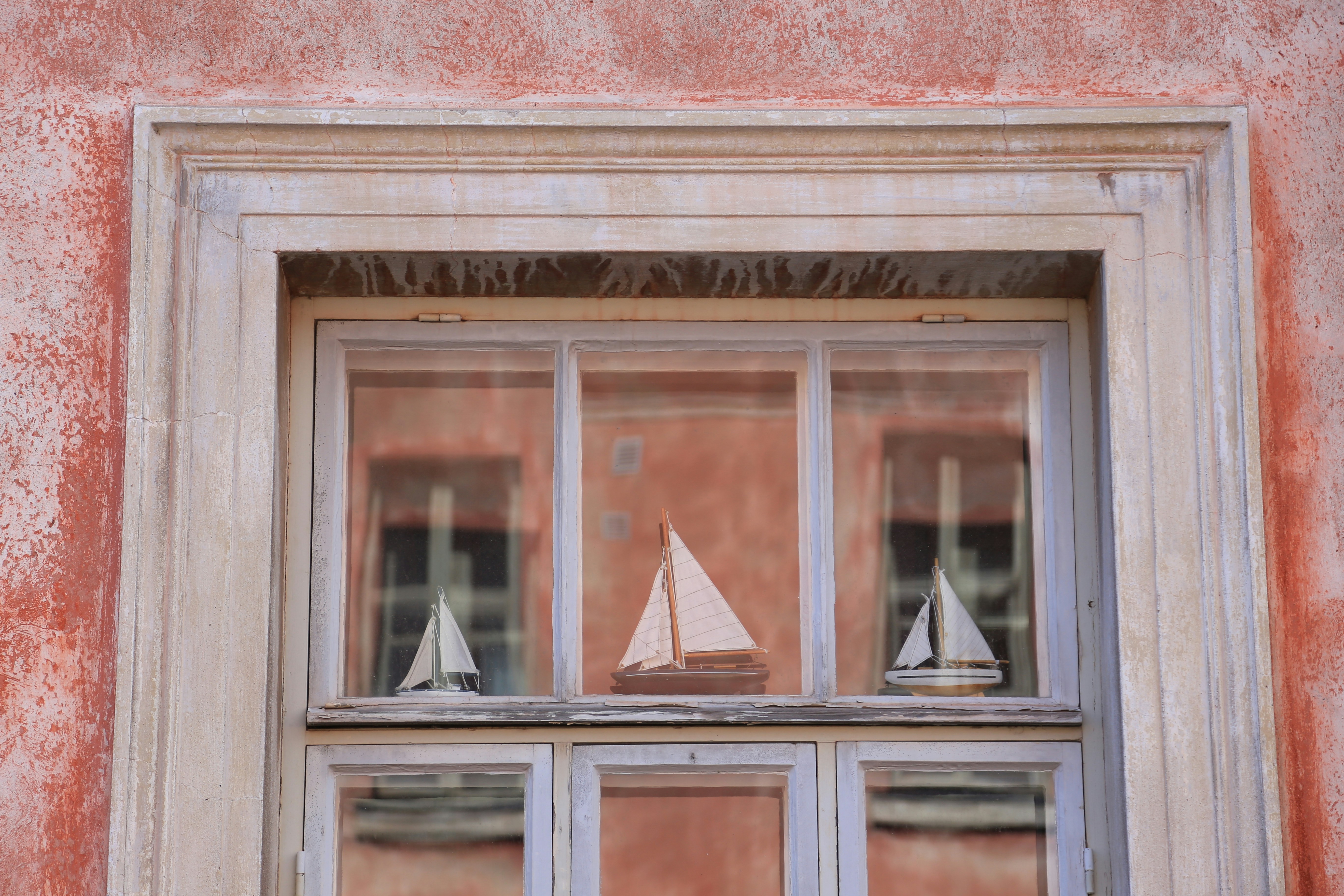 Windowsill Sails: Miniature Boats in a Weathered Frame