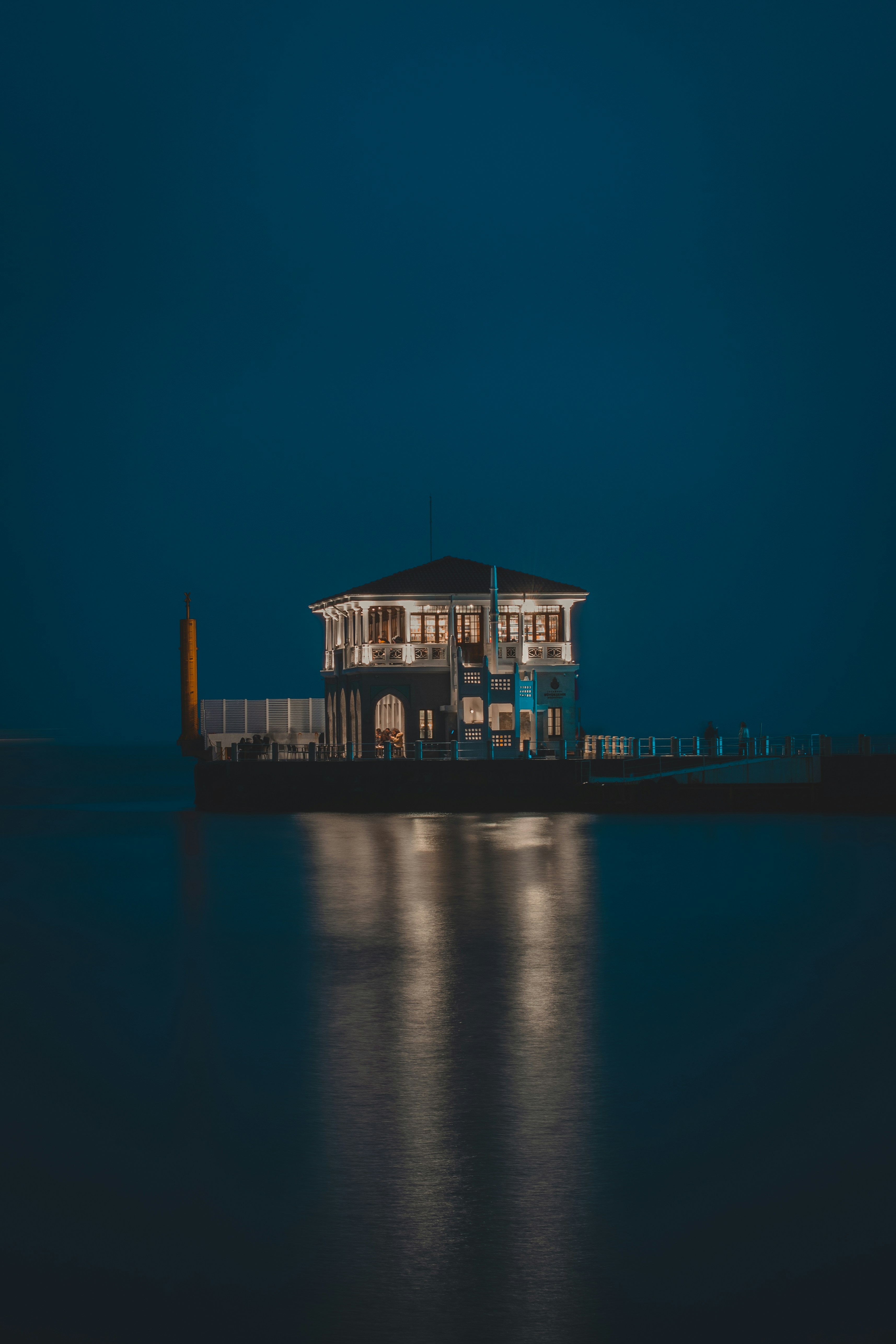 Midnight Pierhouse: A Quiet Beacon on Velvet Water