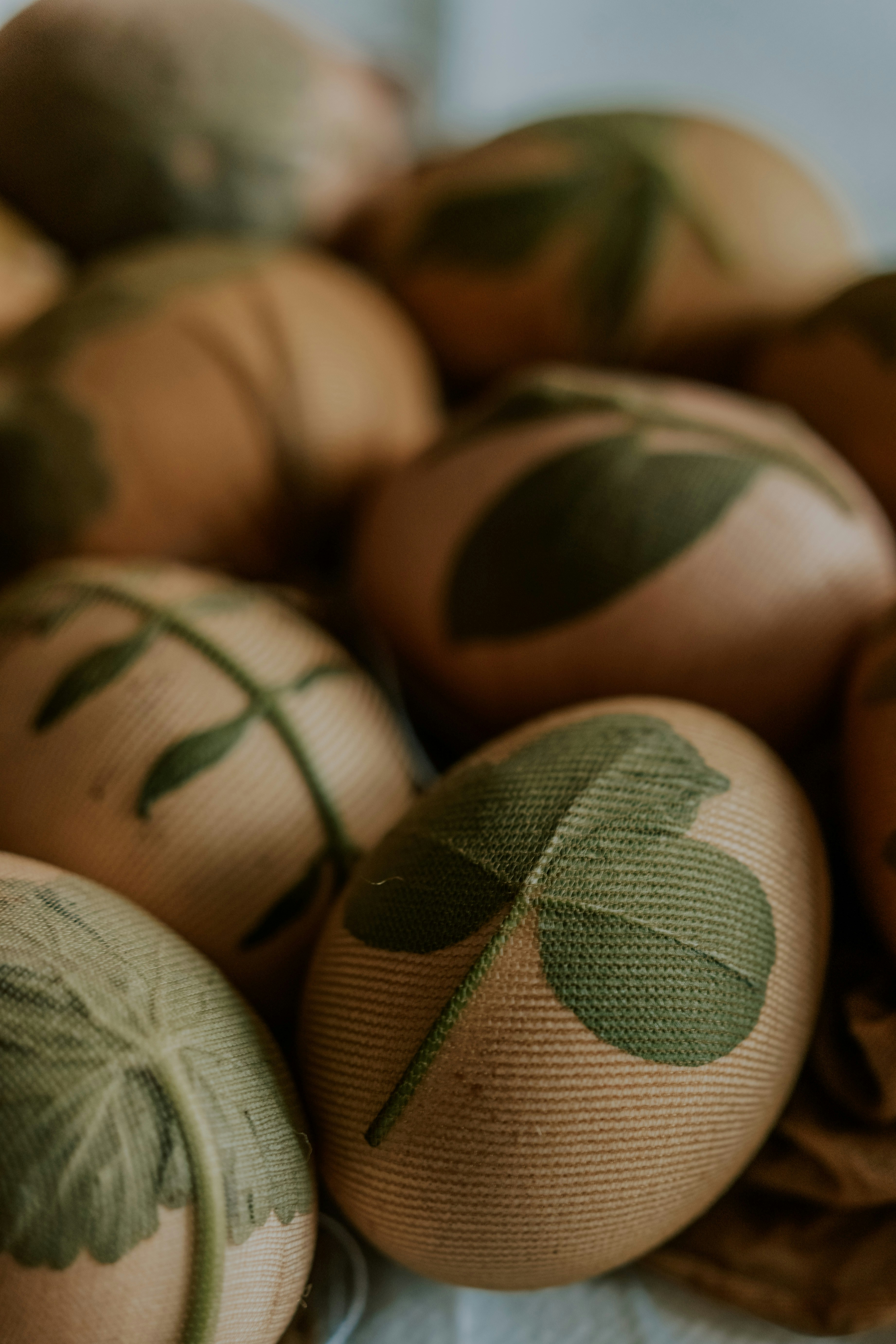 A bunch of eggs with leaves painted on them photo – Free Food Image on ...