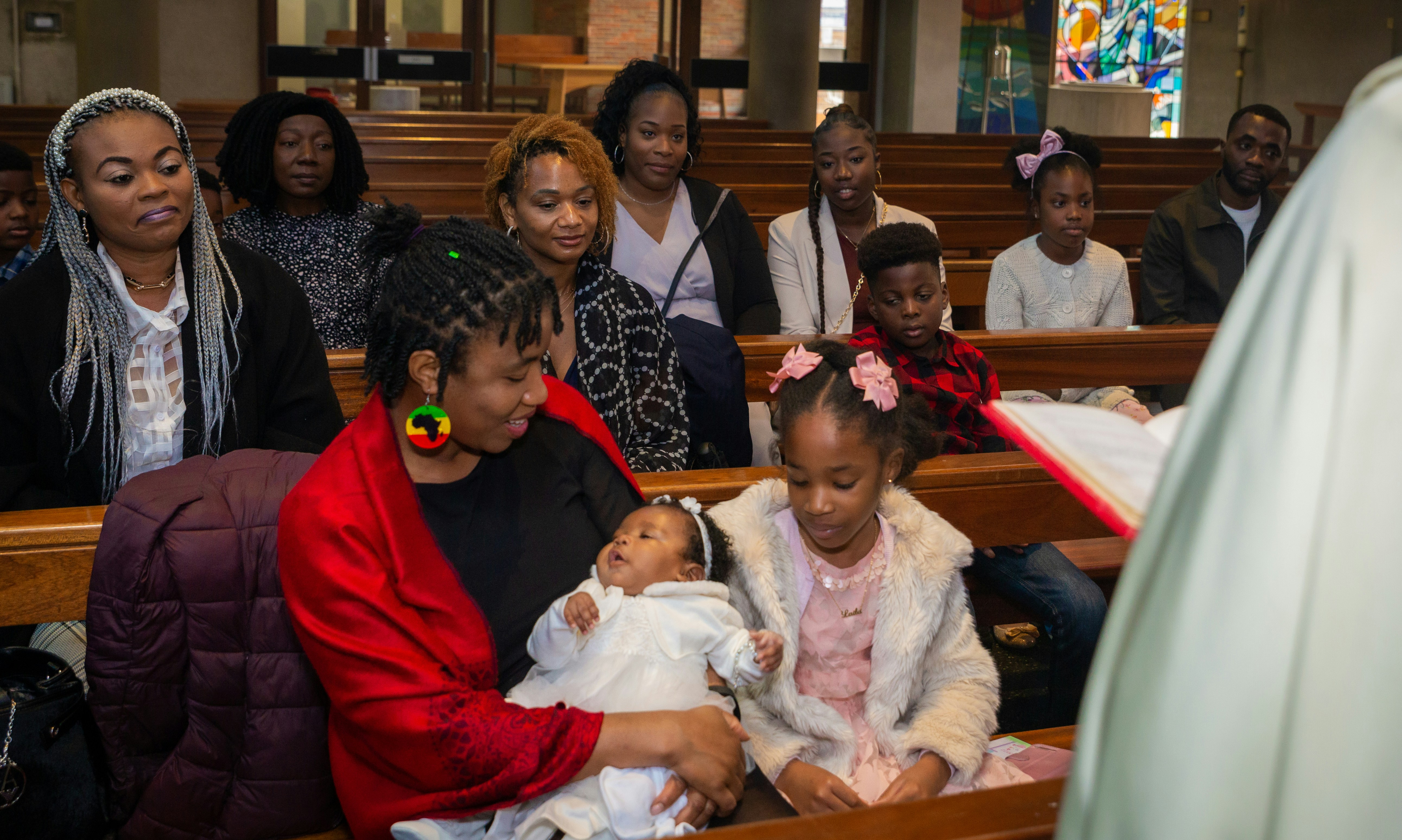 A group of people sitting in pews in a church photo – Free Woman Image ...