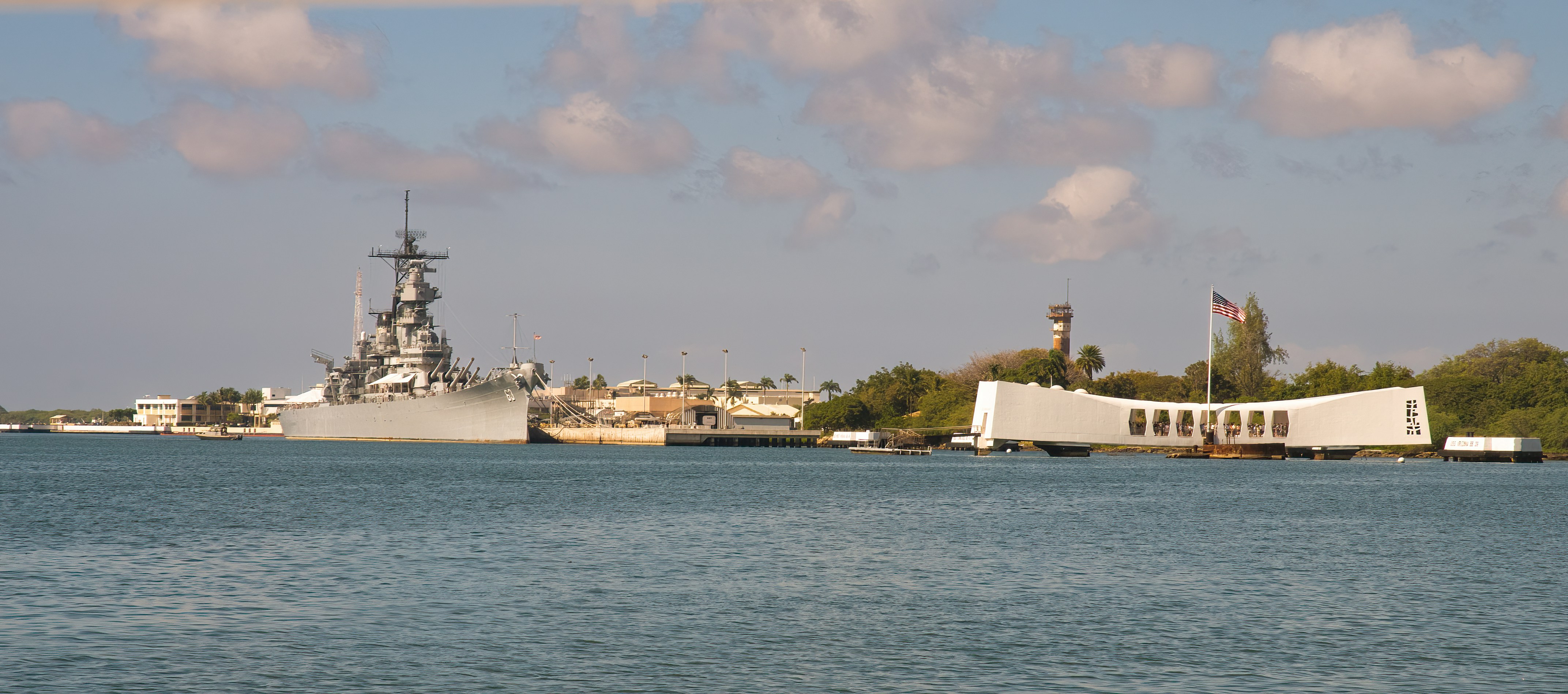 A large battleship sitting in the middle of a body of water photo ...