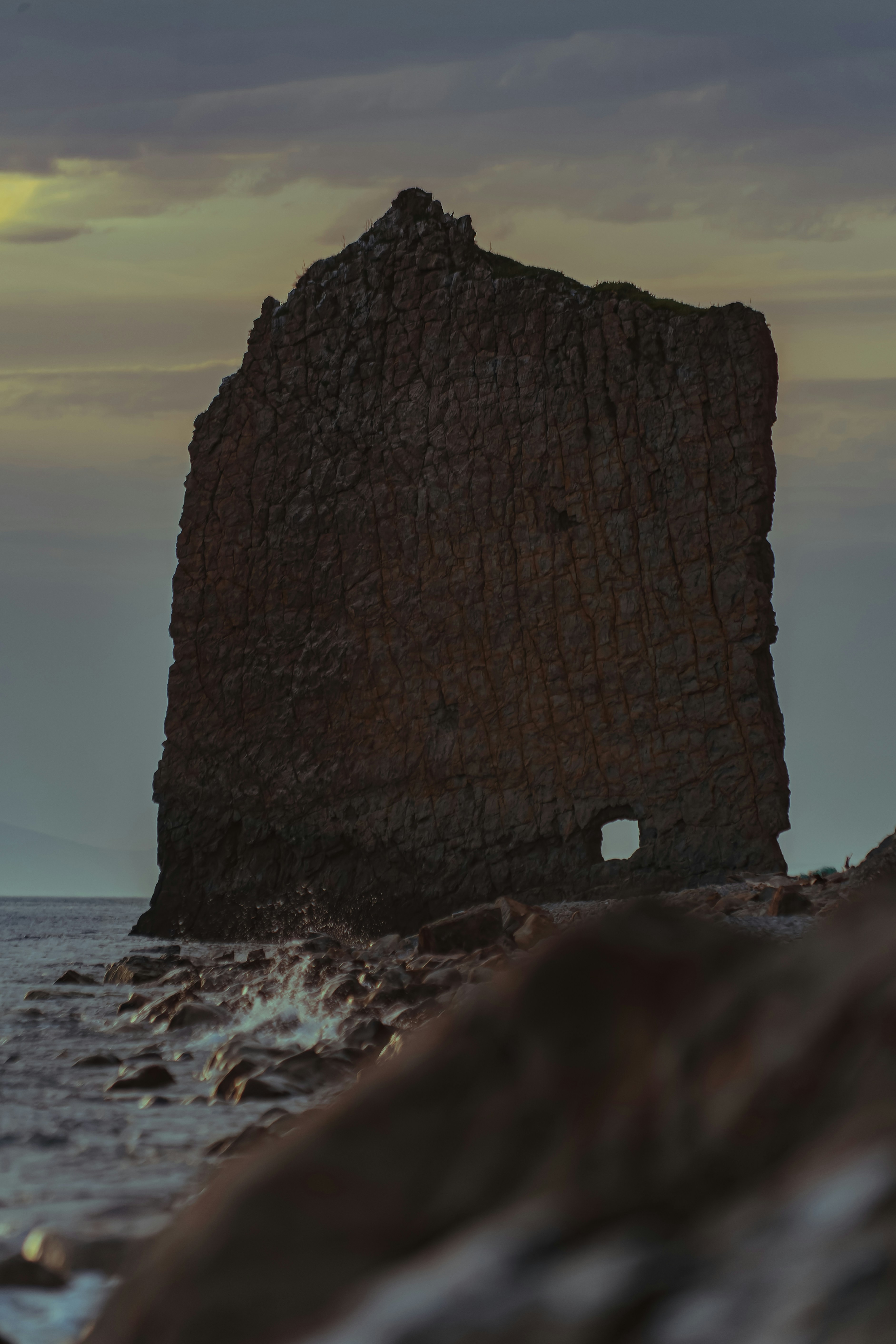 Sea Stack at Dusk: Weathered Gate Carved by Tide