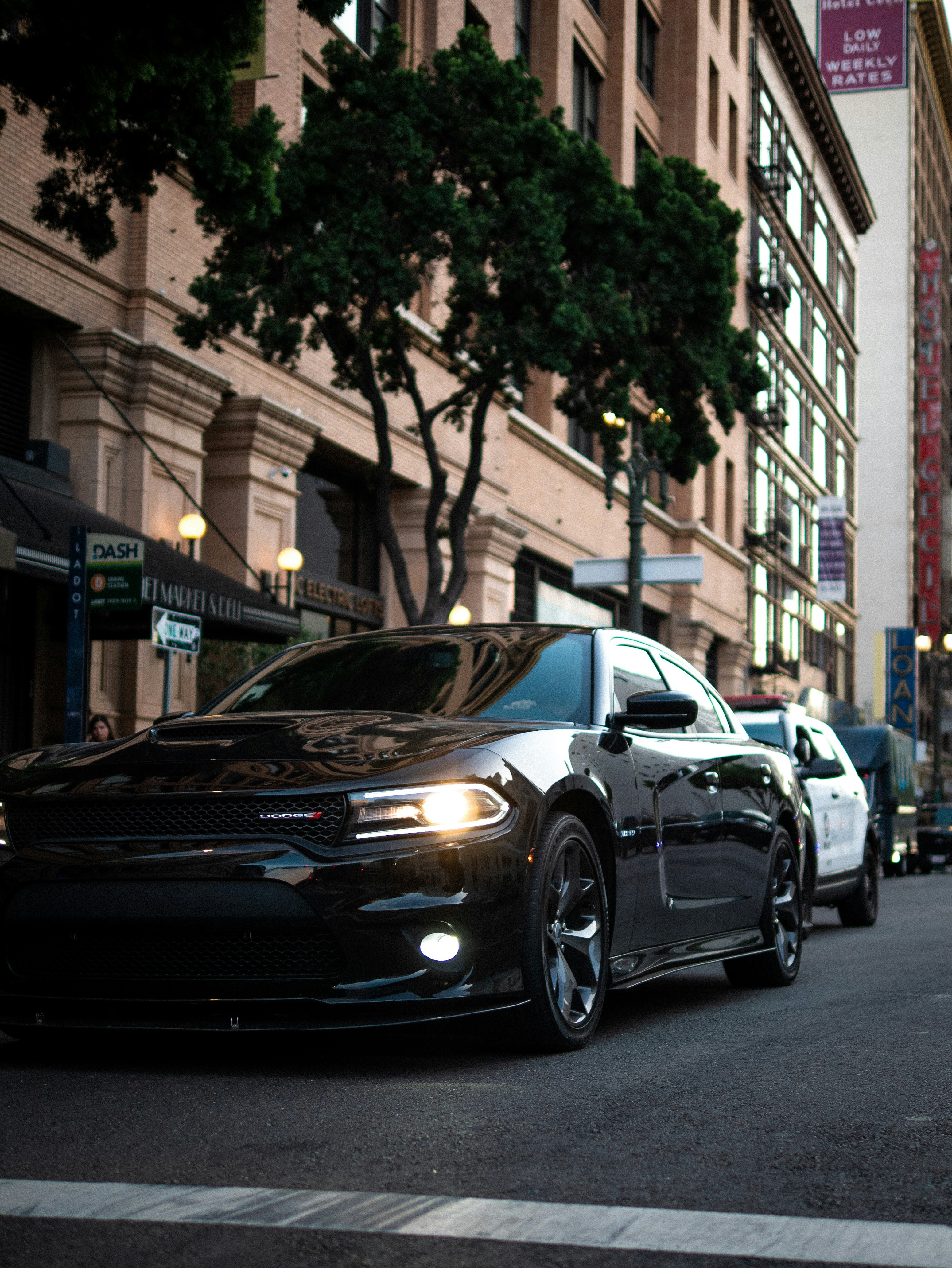 Downtown Stance: A Black Charger Commands a City Street